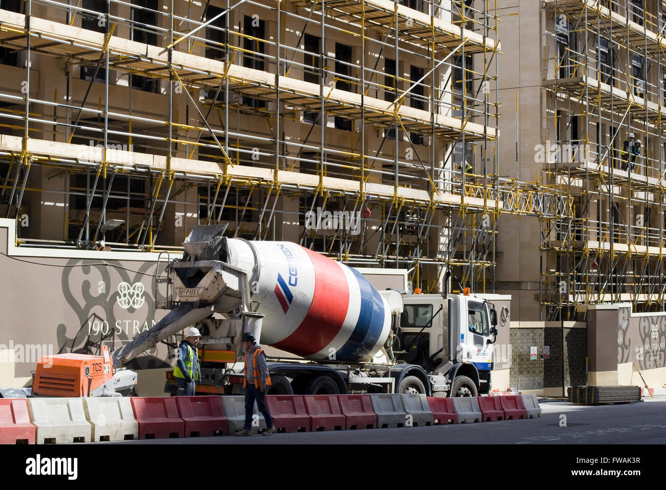 Pouring concrete into ground on a building site in London Stock Photo ...