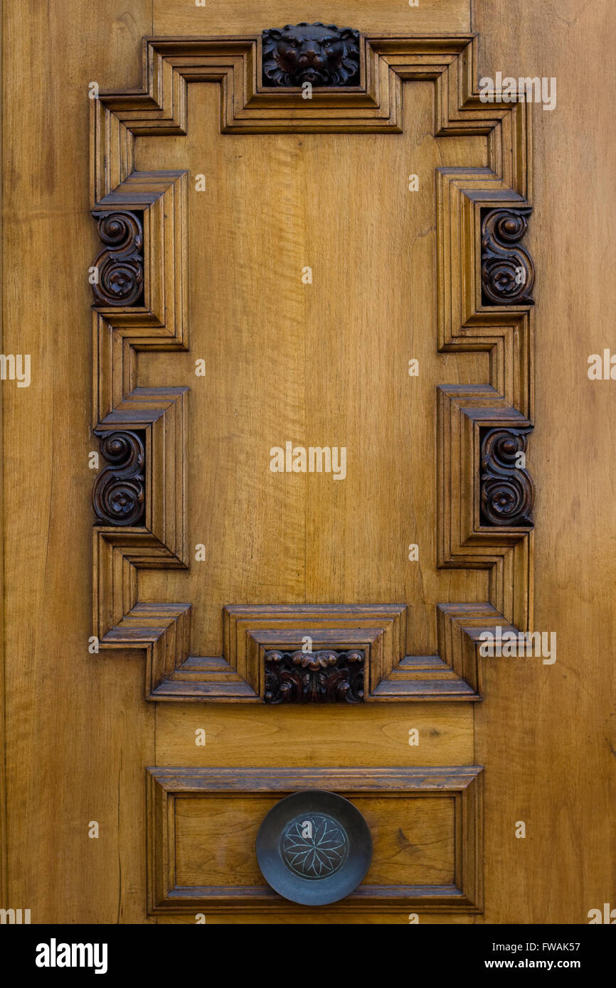 Decorative wooden door with a tiger door bronze Stock Photo - Alamy