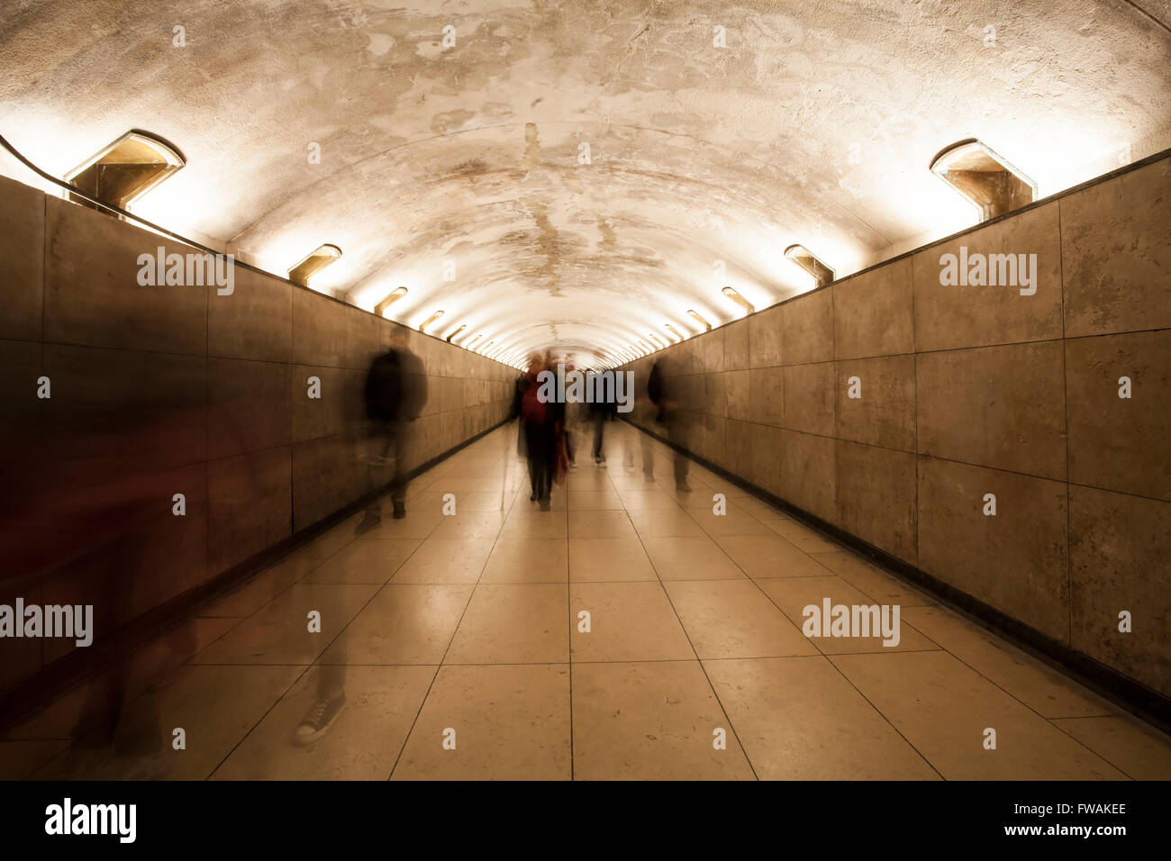 Human shadows in the subway corridor Stock Photo - Alamy