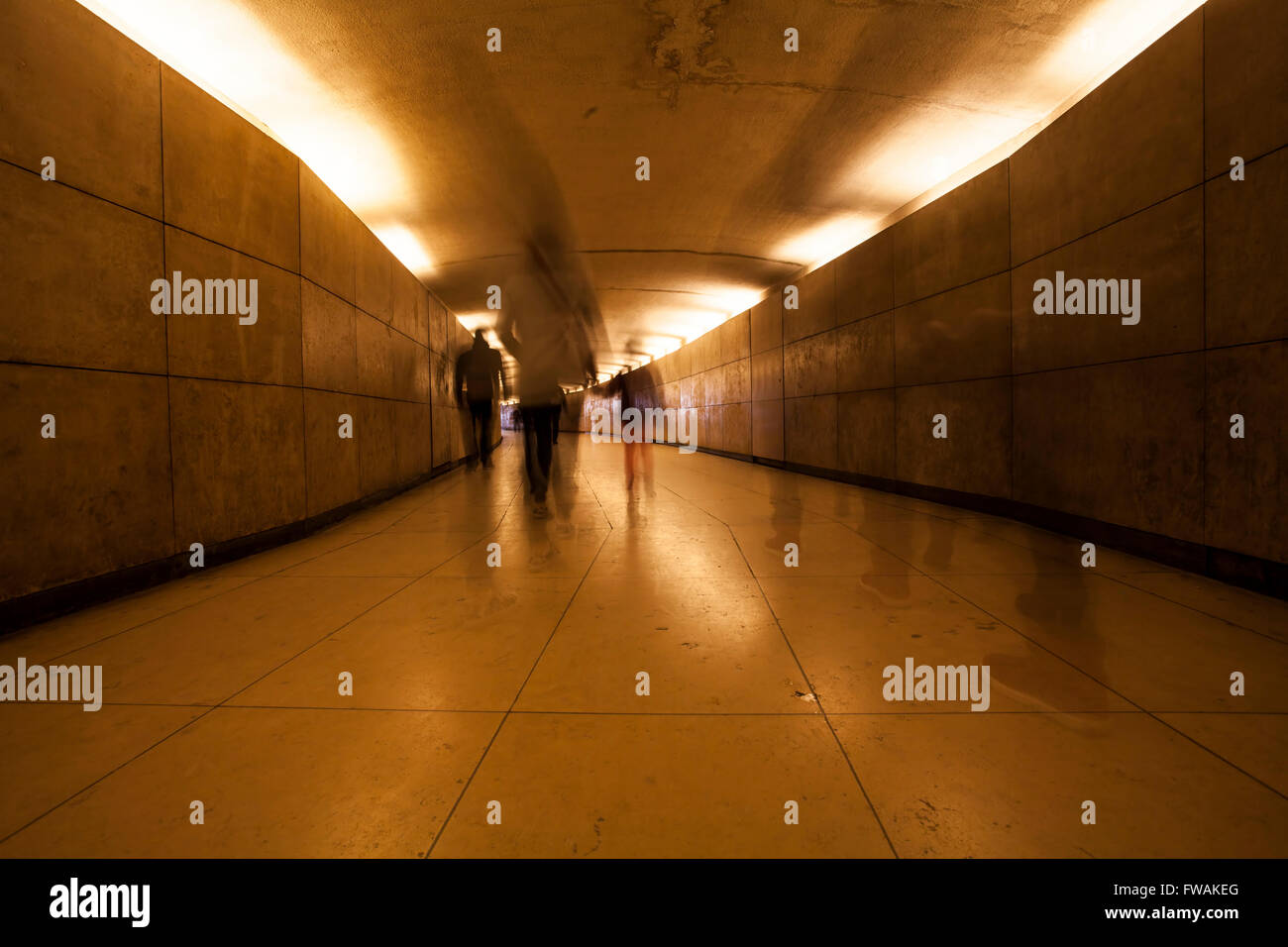Human shadows in the subway corridor Stock Photo - Alamy