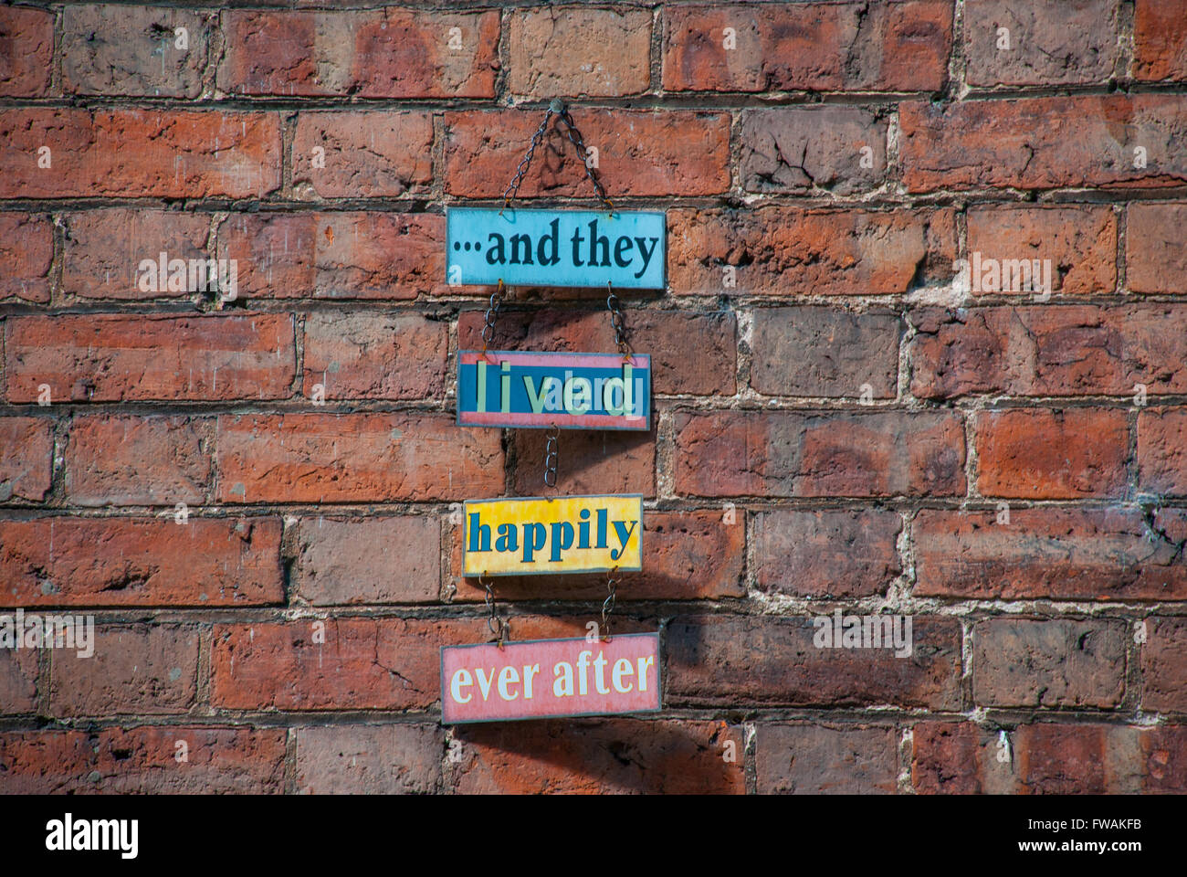 Sign hanging on a wall Stock Photo - Alamy