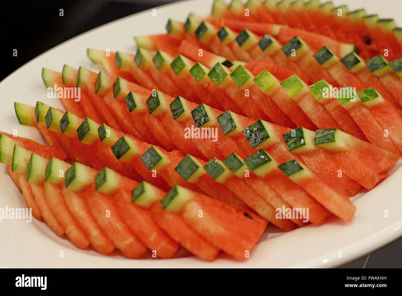 peel watermelon in white plate on buffet line Stock Photo - Alamy