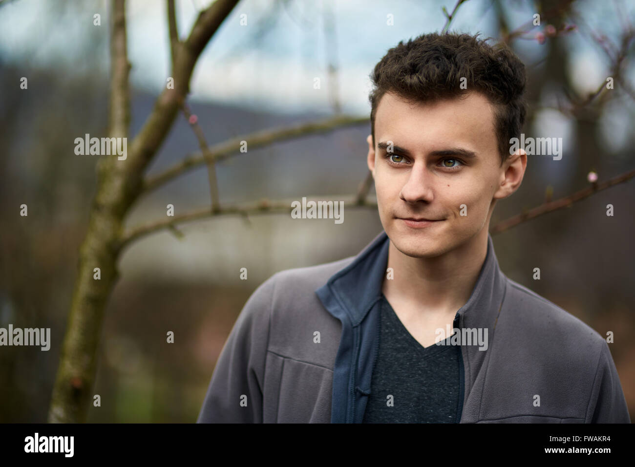 Closeup of a handsome teenage boy outdoor Stock Photo - Alamy