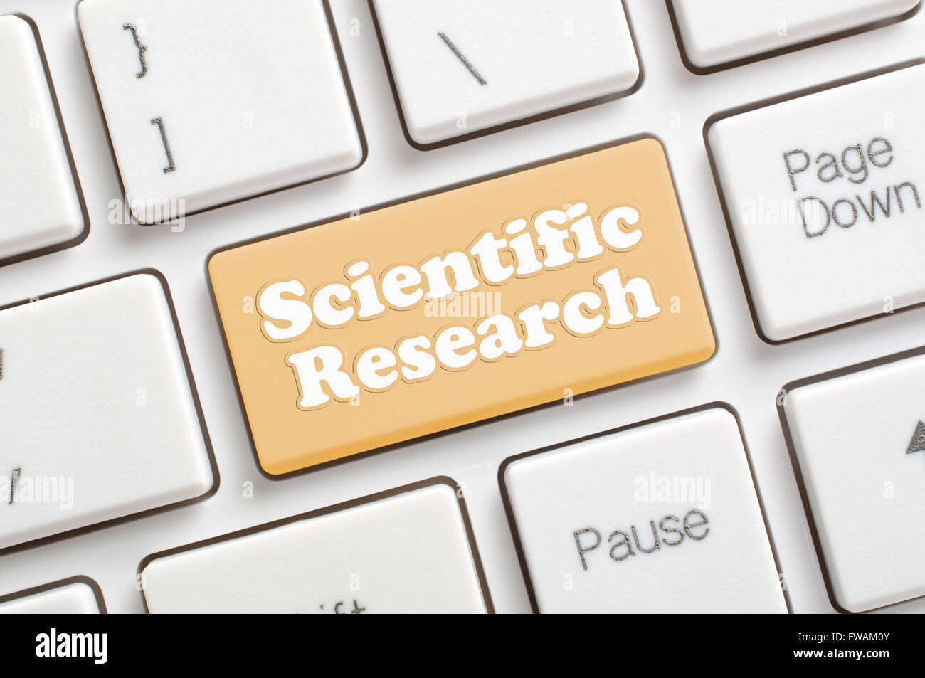 Brown scientific research key on keyboard Stock Photo - Alamy