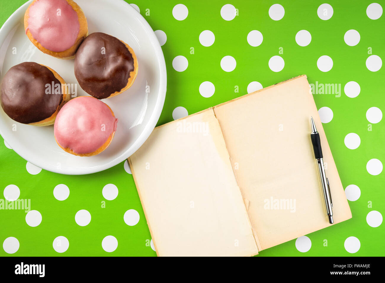 Vintage notebook with recipe for delicious homemade donuts with topping ...