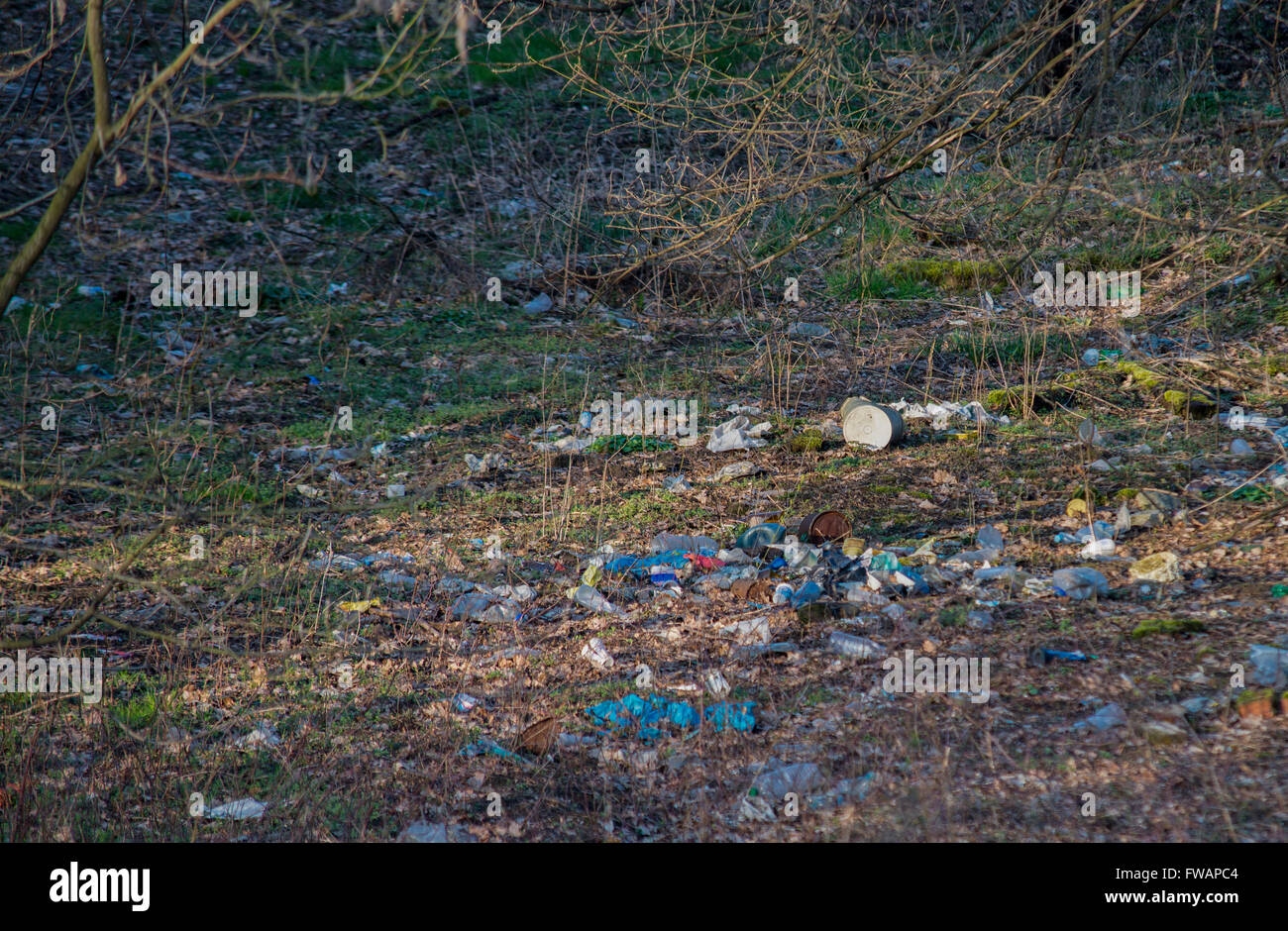Heap of rubbish on grass in sunny park Stock Photo - Alamy