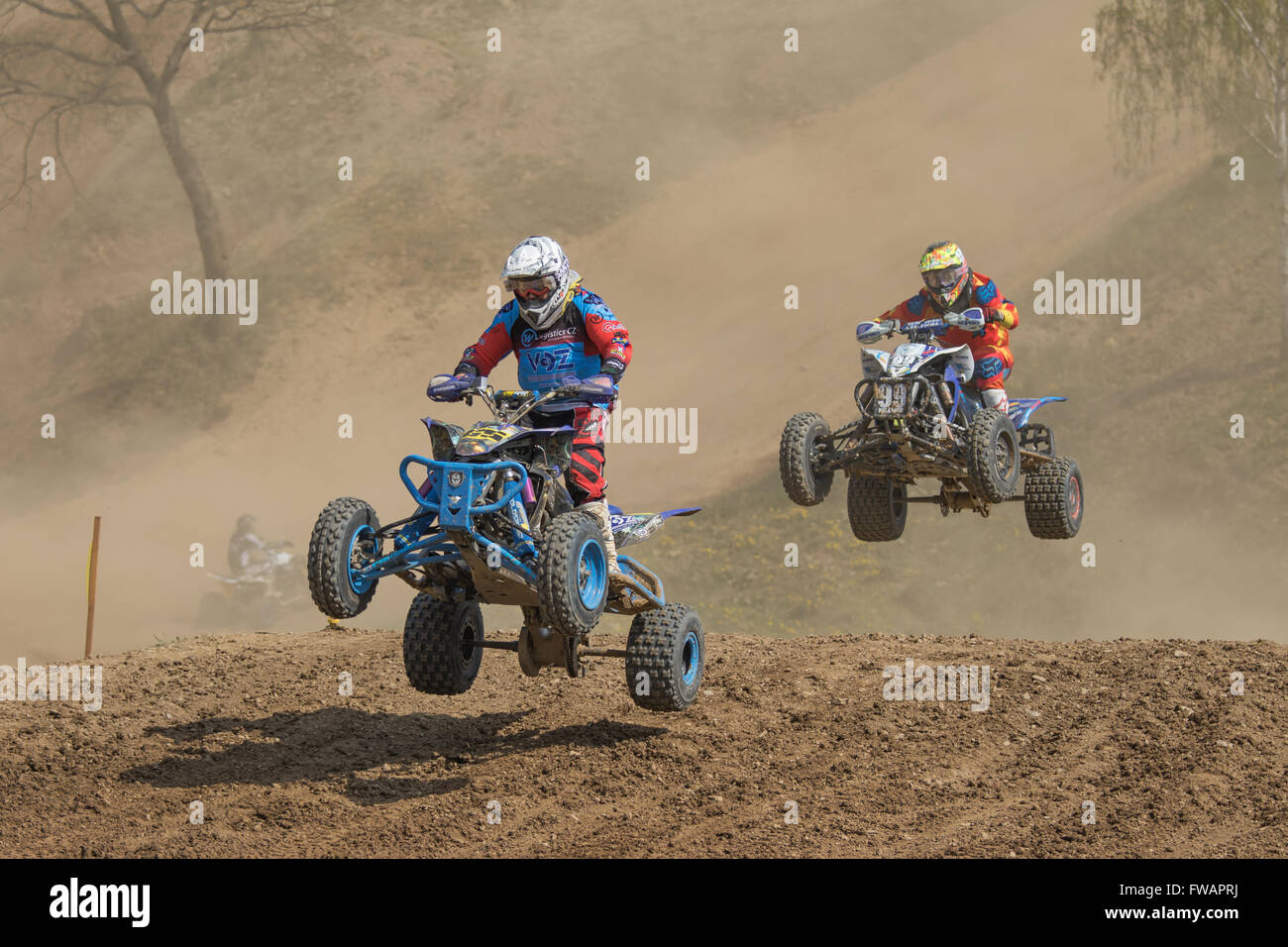 Two quad riders in a jumping in the race Stock Photo - Alamy