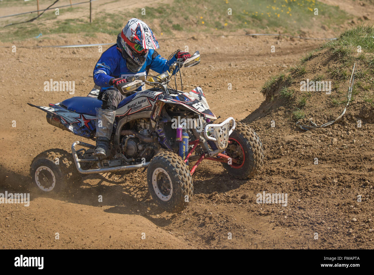Junior racer is outgoing from the bend in the race Stock Photo - Alamy