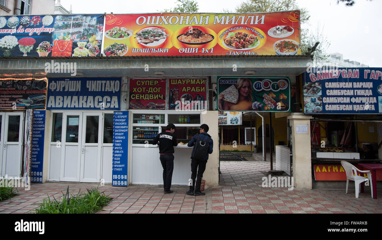 Dushanbe, Tajikistan. 01st Apr, 2016. Two men stand in front of a fast ...