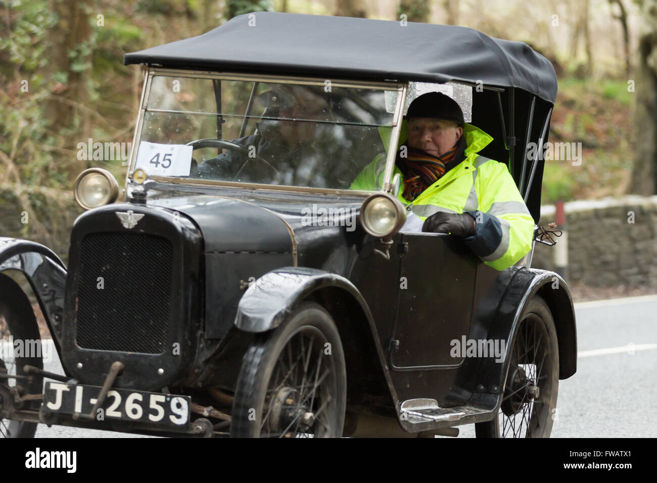 People driving vintage cars Stock Photo - Alamy