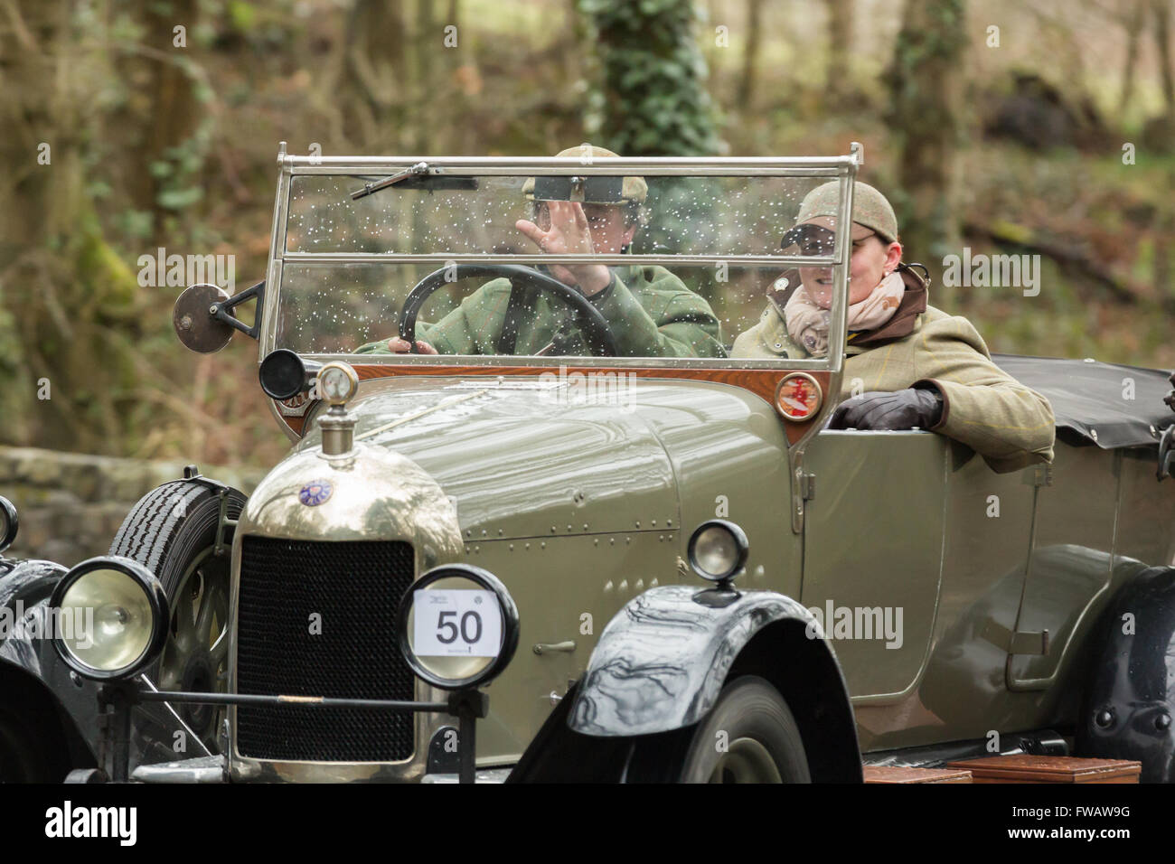 People driving vintage cars Stock Photo - Alamy