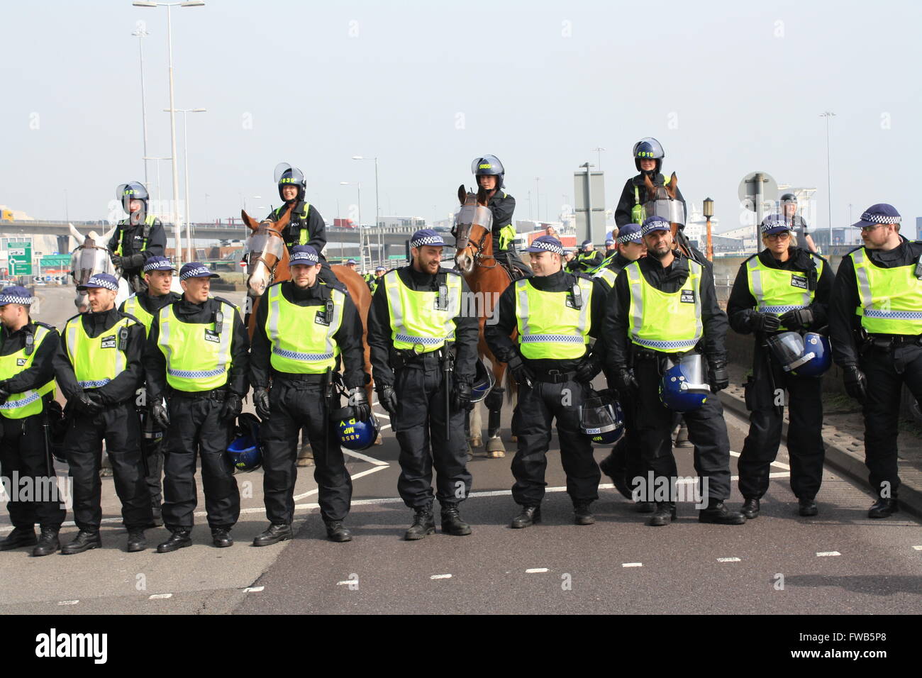 Dover, UK. 02nd Apr, 2016. A line of riot police with police horses ...