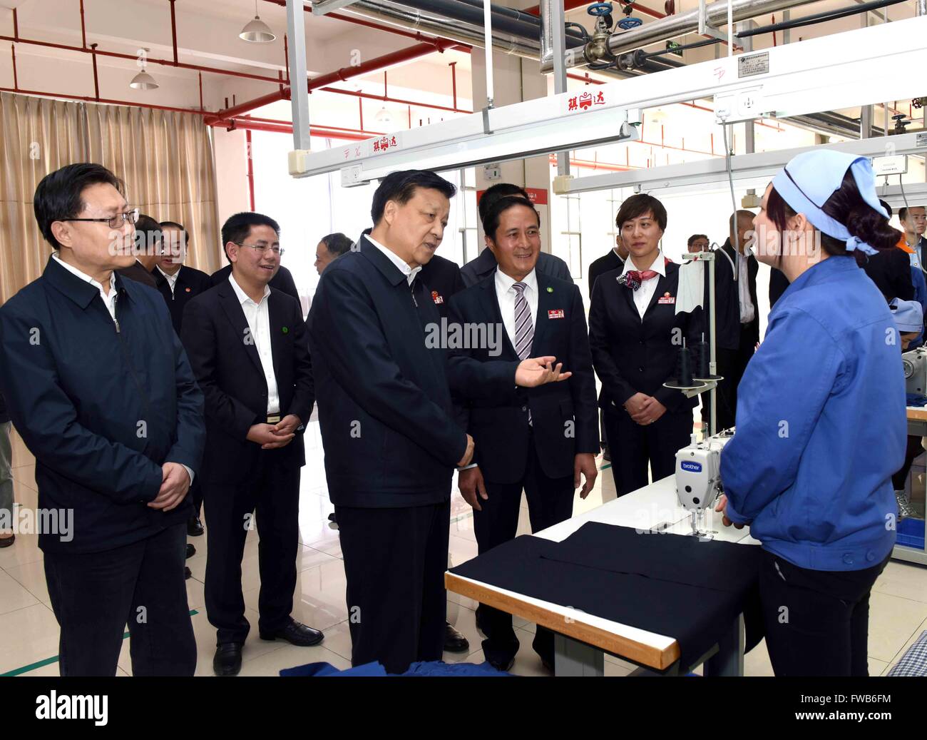 Lincang, China's Sichuan Province. 30th Mar, 2016. Liu Yunshan(2nd L ...