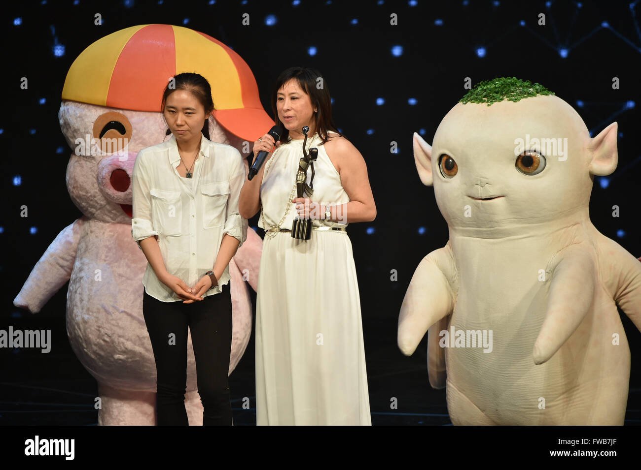Hong Kong, China. 3rd Apr, 2016. Ellen Poon (R) speaks while Tang Bingbing stands beside her ...