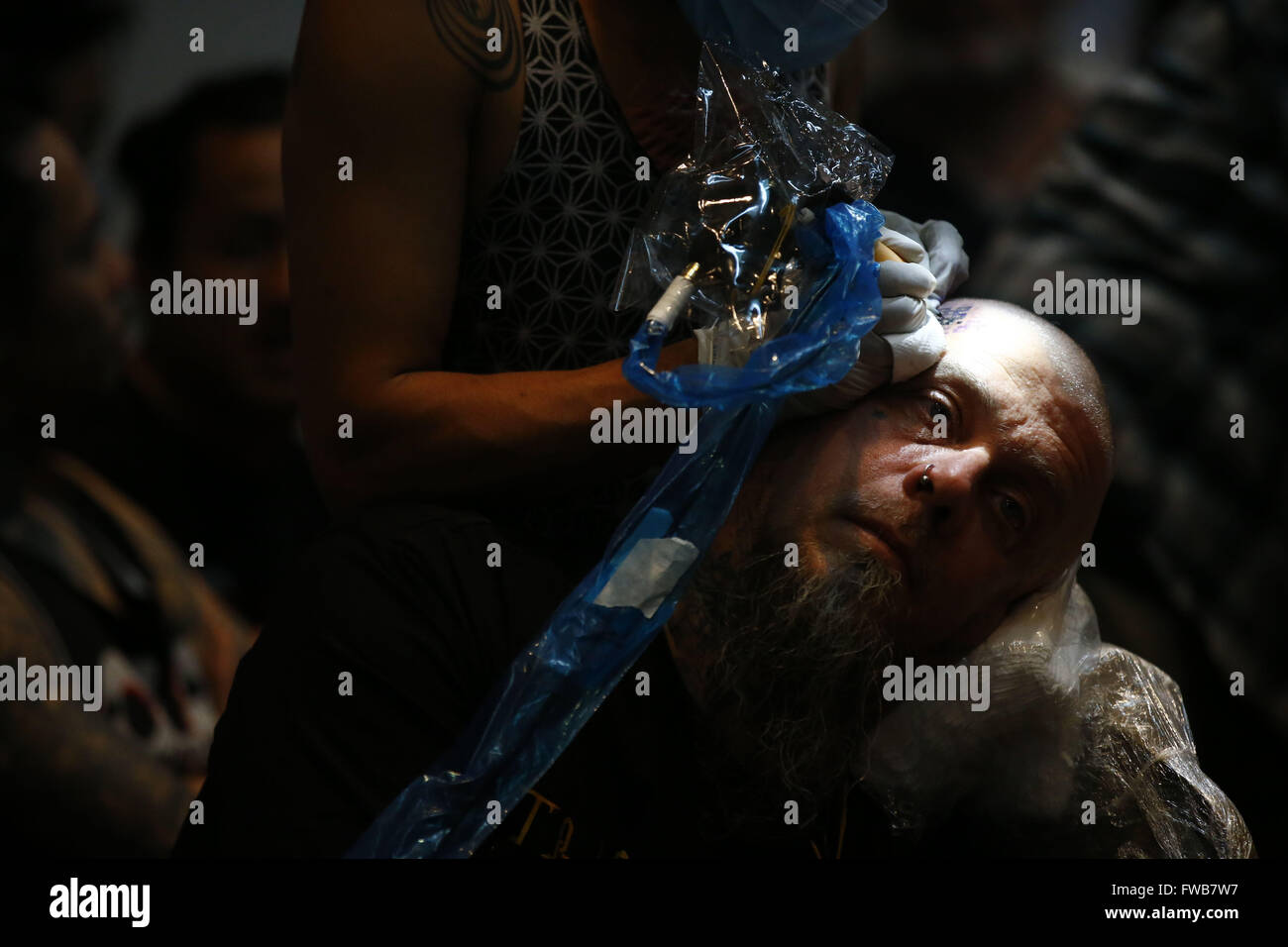 Kathmandu, Nepal. 3rd Apr, 2016. A tattoo artist works on a tattoo ...