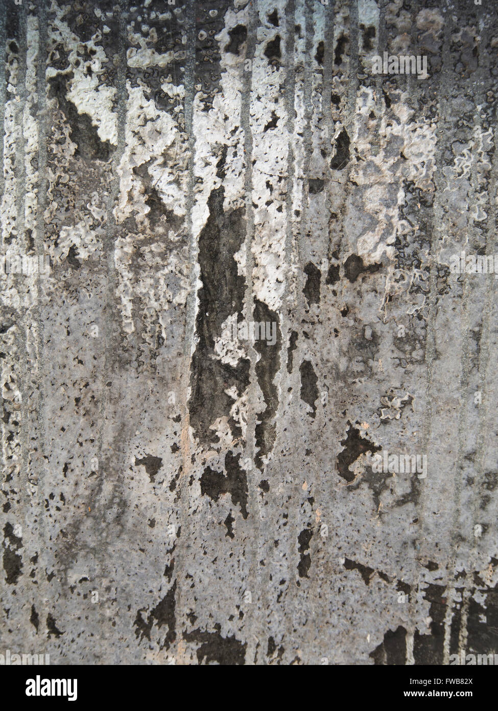 weathered grunge surface texture in shades of gray, some vertical lines ...