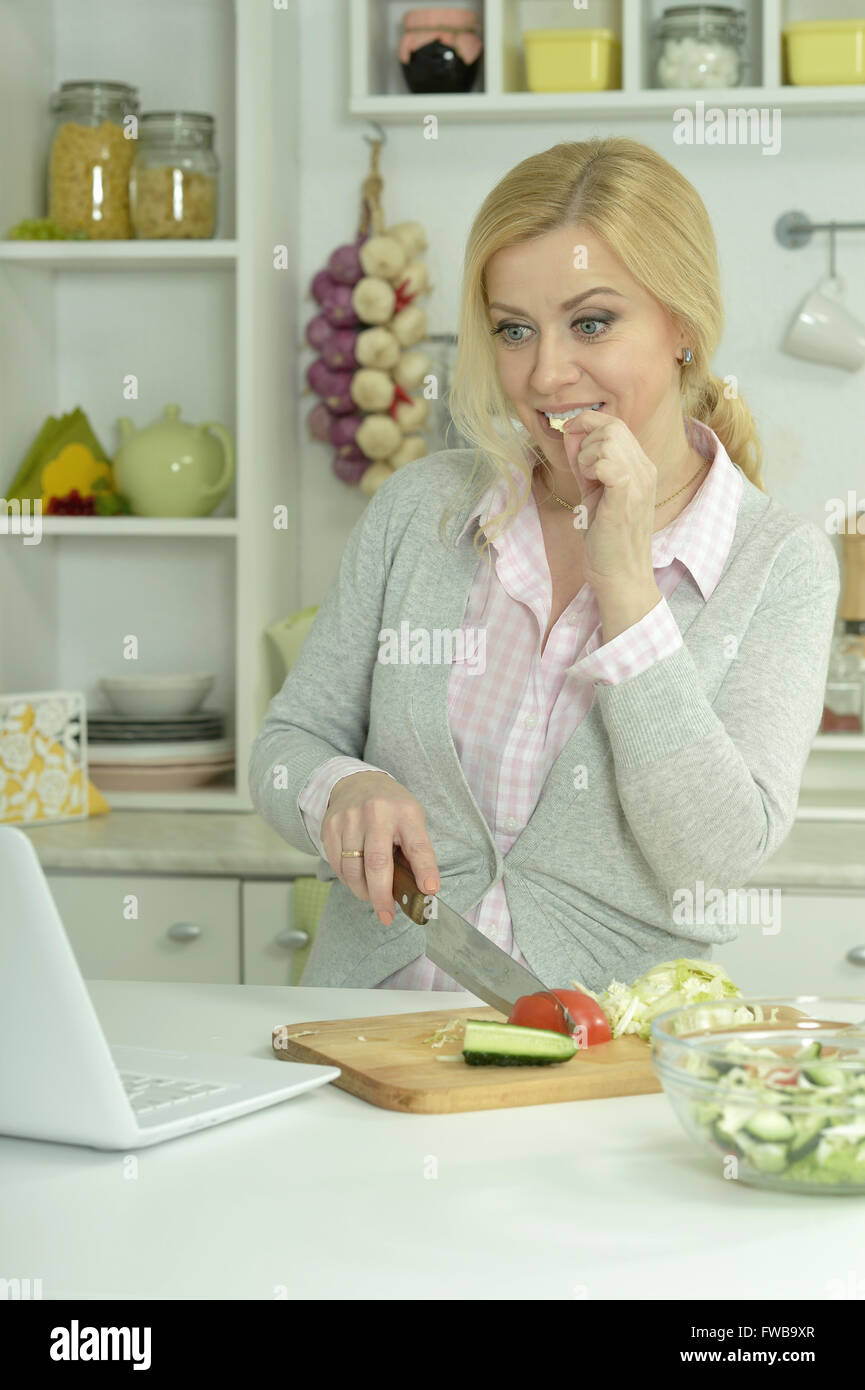 Young woman cooking in the kitchen Stock Photo - Alamy