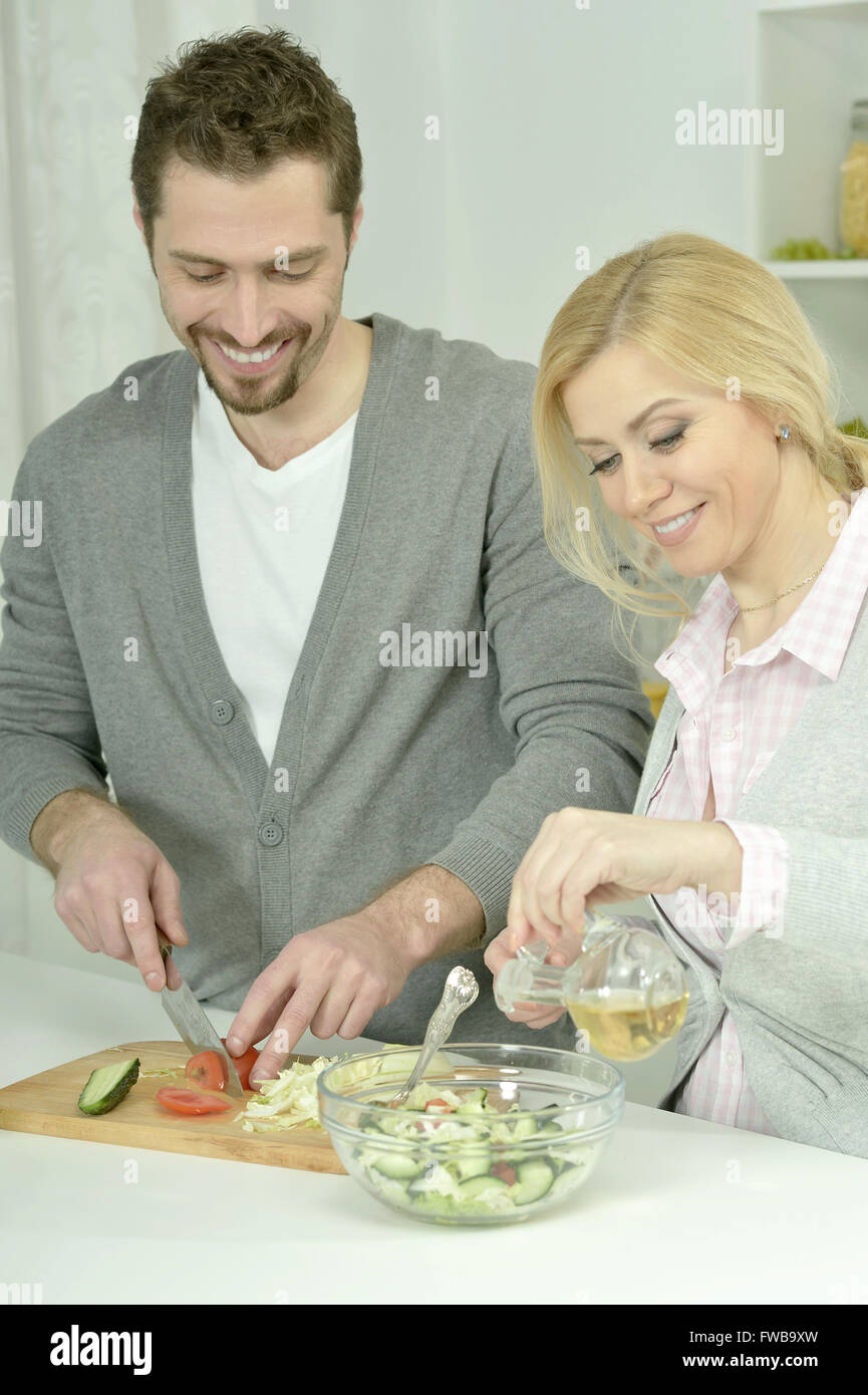 happy couple cooking in kitchen Stock Photo - Alamy