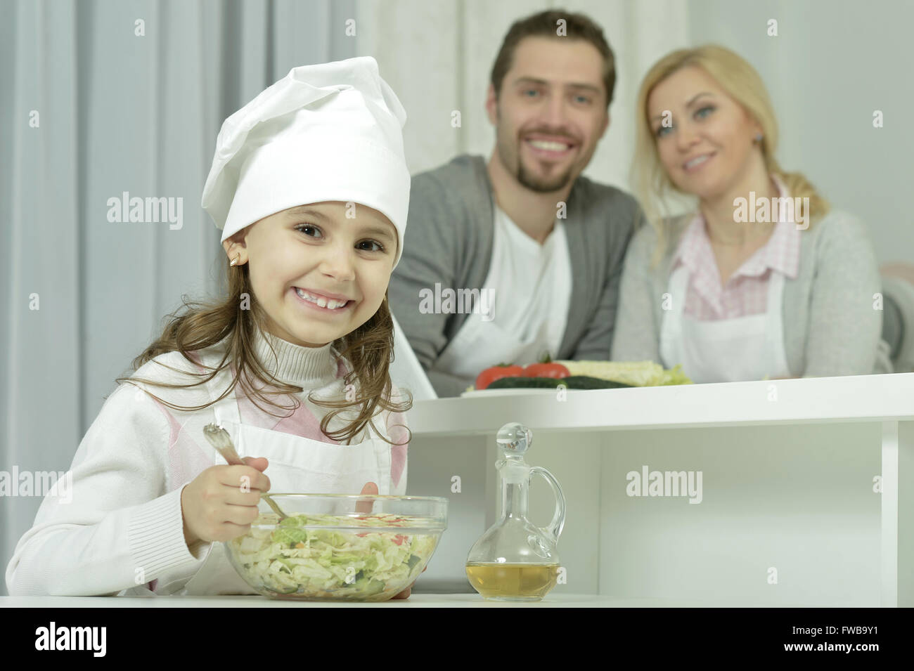 happy family cooking in kitchen Stock Photo - Alamy