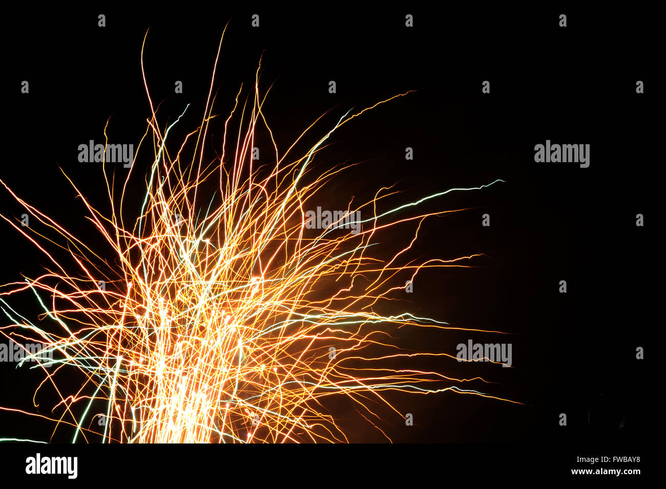 Photo of a long exposed firework exploding into the night sky for ...