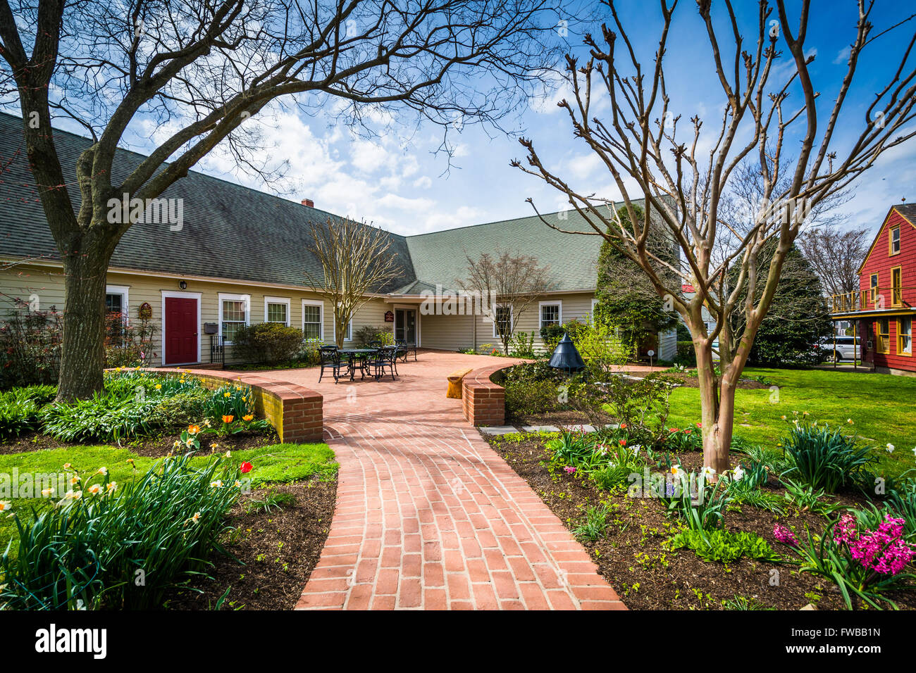 Gardens along a walkway and buildings in Lewes, Delaware Stock Photo ...