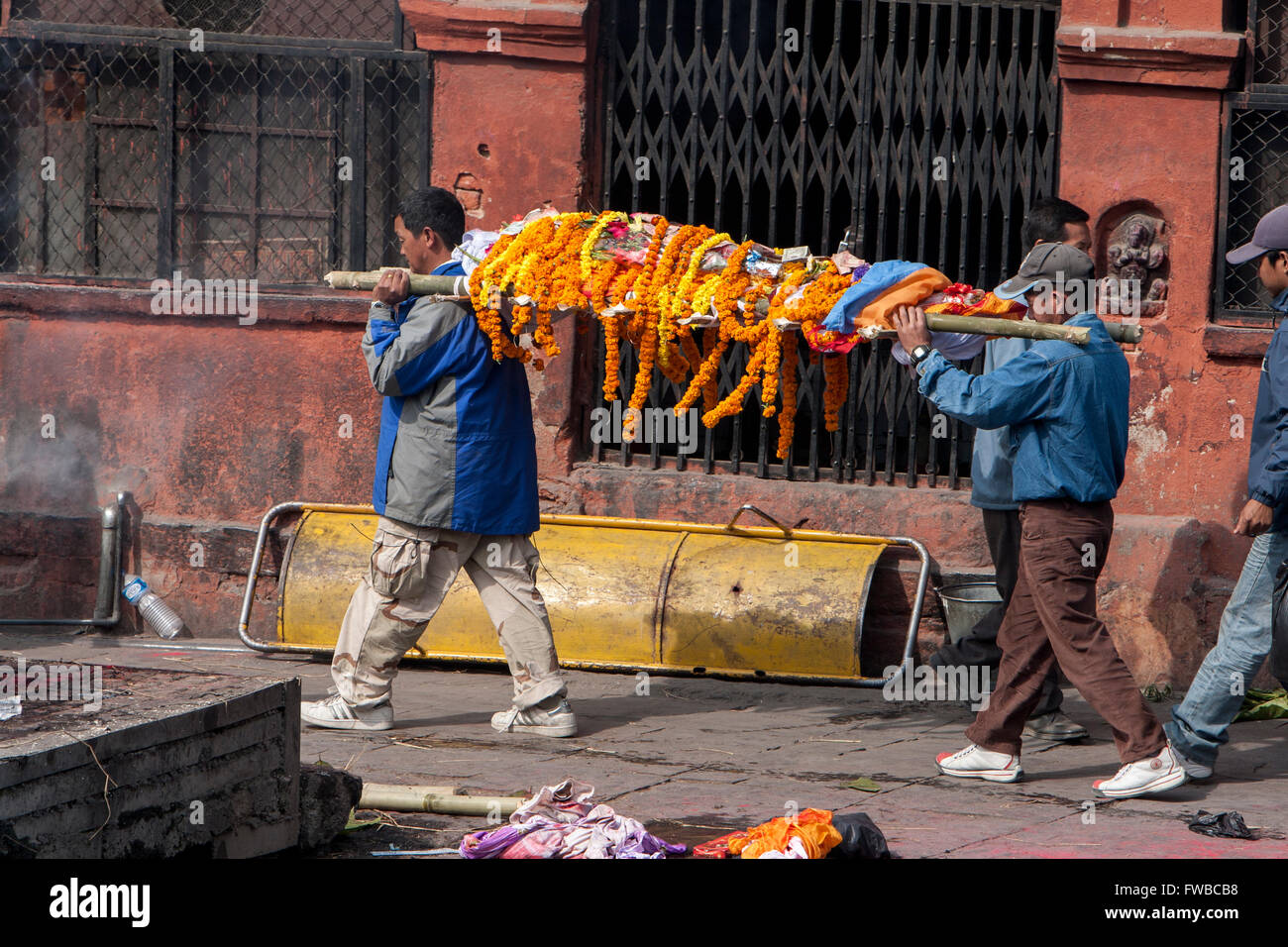 Nepal, Pashupatinath. Cremation Stages. Carrying a Corpse, covered in ...