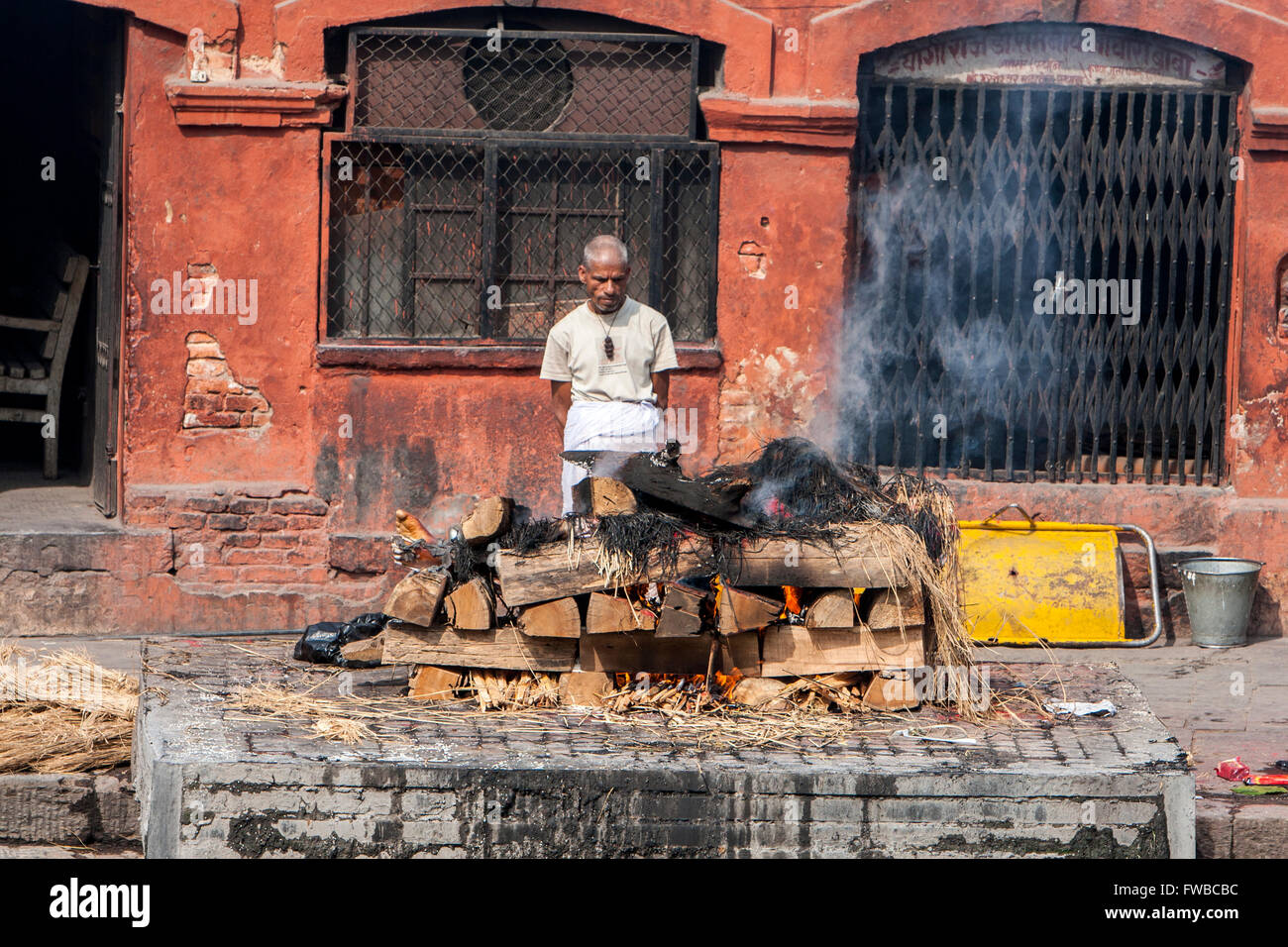 Nepal, Pashupatinath. Cremation Stages. A Family Member Oversees the ...