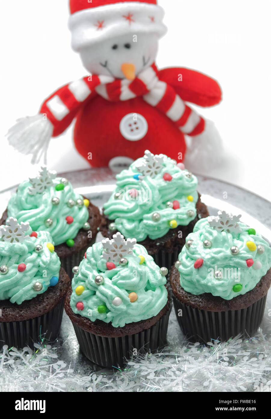 Decorated Christmas cupcakes on white background Stock Photo - Alamy