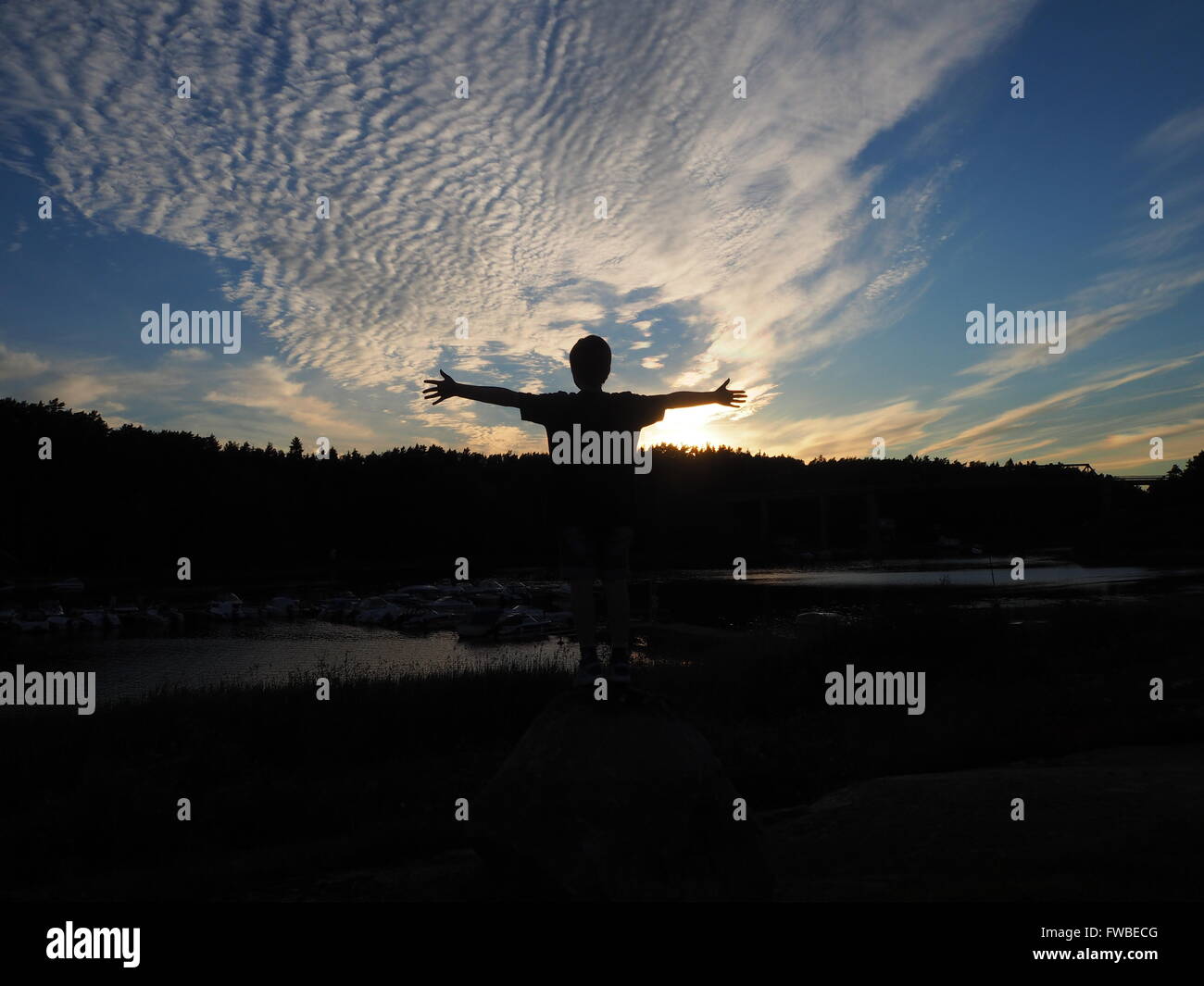 Person standing in front of sunset hi-res stock photography and images ...