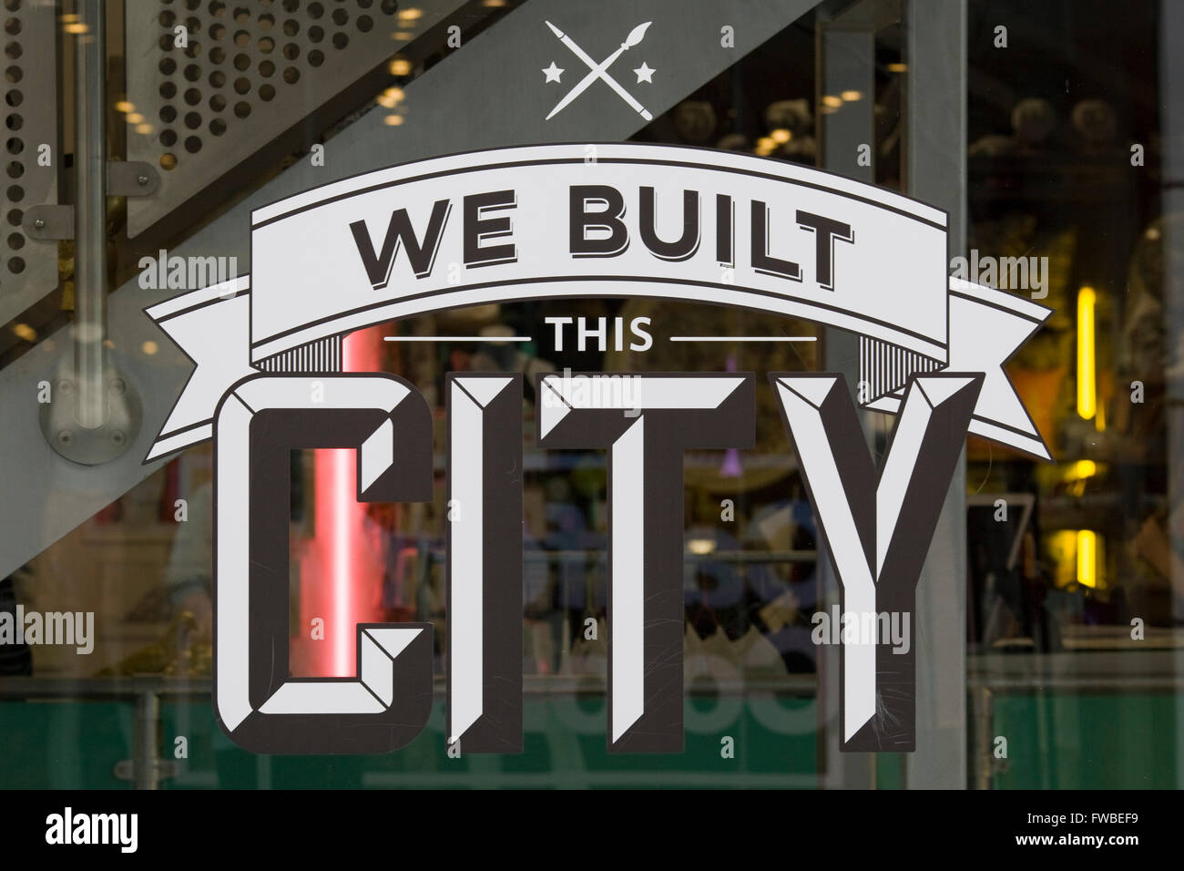 Shop window sign advertising "we built this city Stock Photo - Alamy