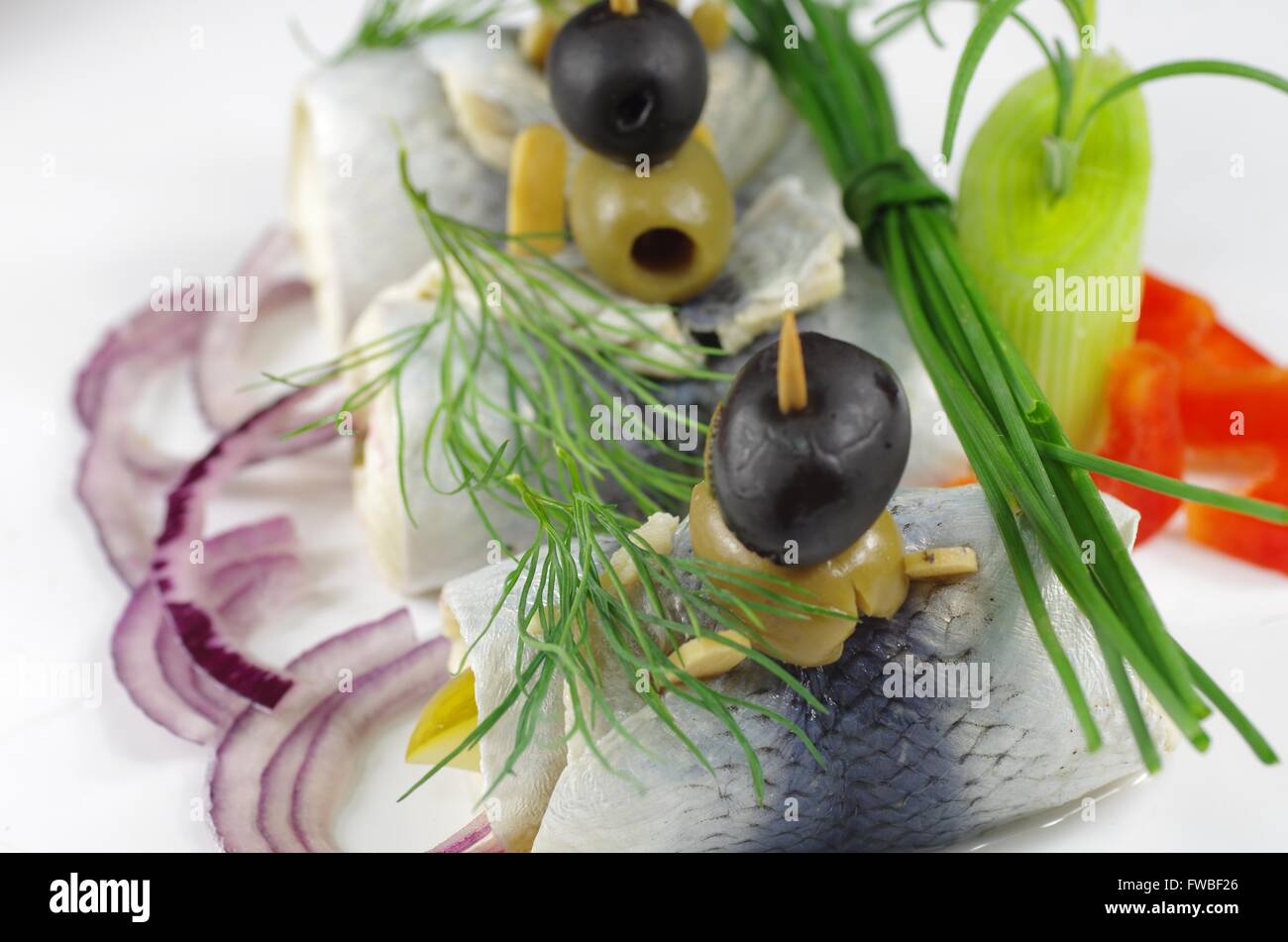 appetizing rollmop with onion and dill Stock Photo - Alamy