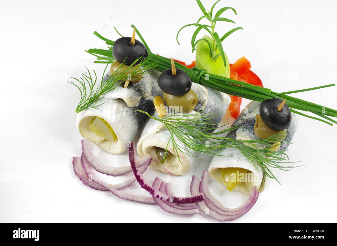 appetizing rollmop with onion and dill Stock Photo - Alamy