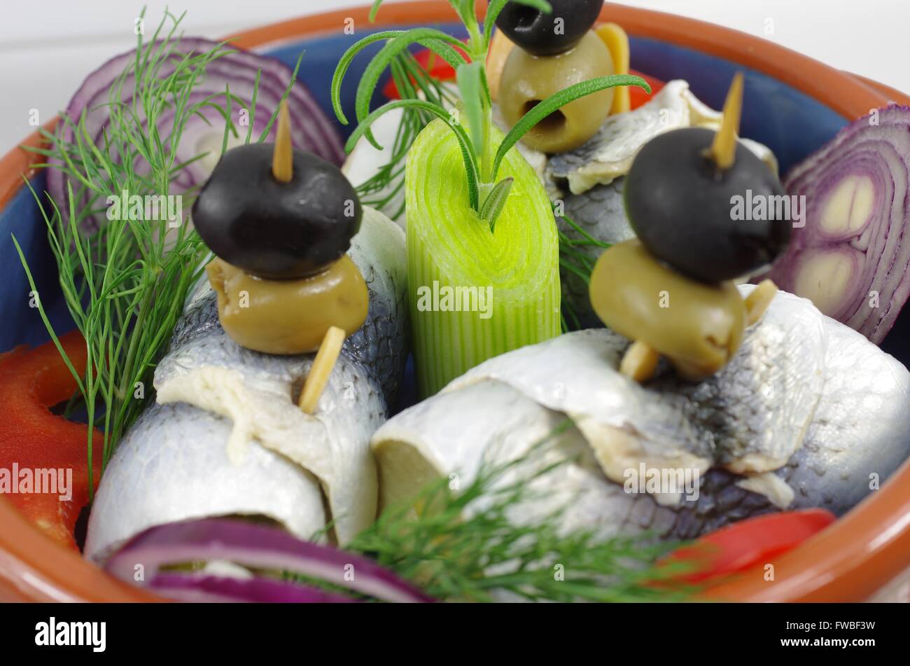 appetizing rollmop with onion and dill Stock Photo - Alamy