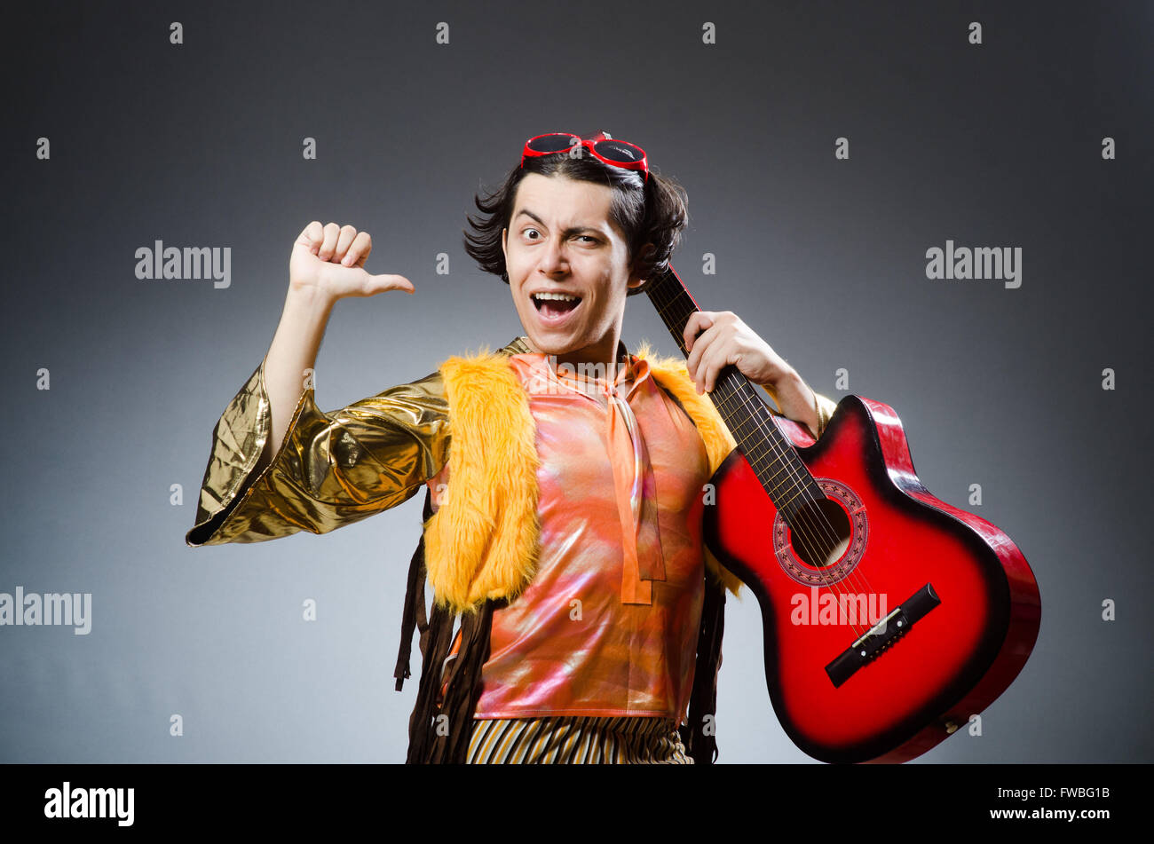 Man with guitar in musical concept Stock Photo - Alamy