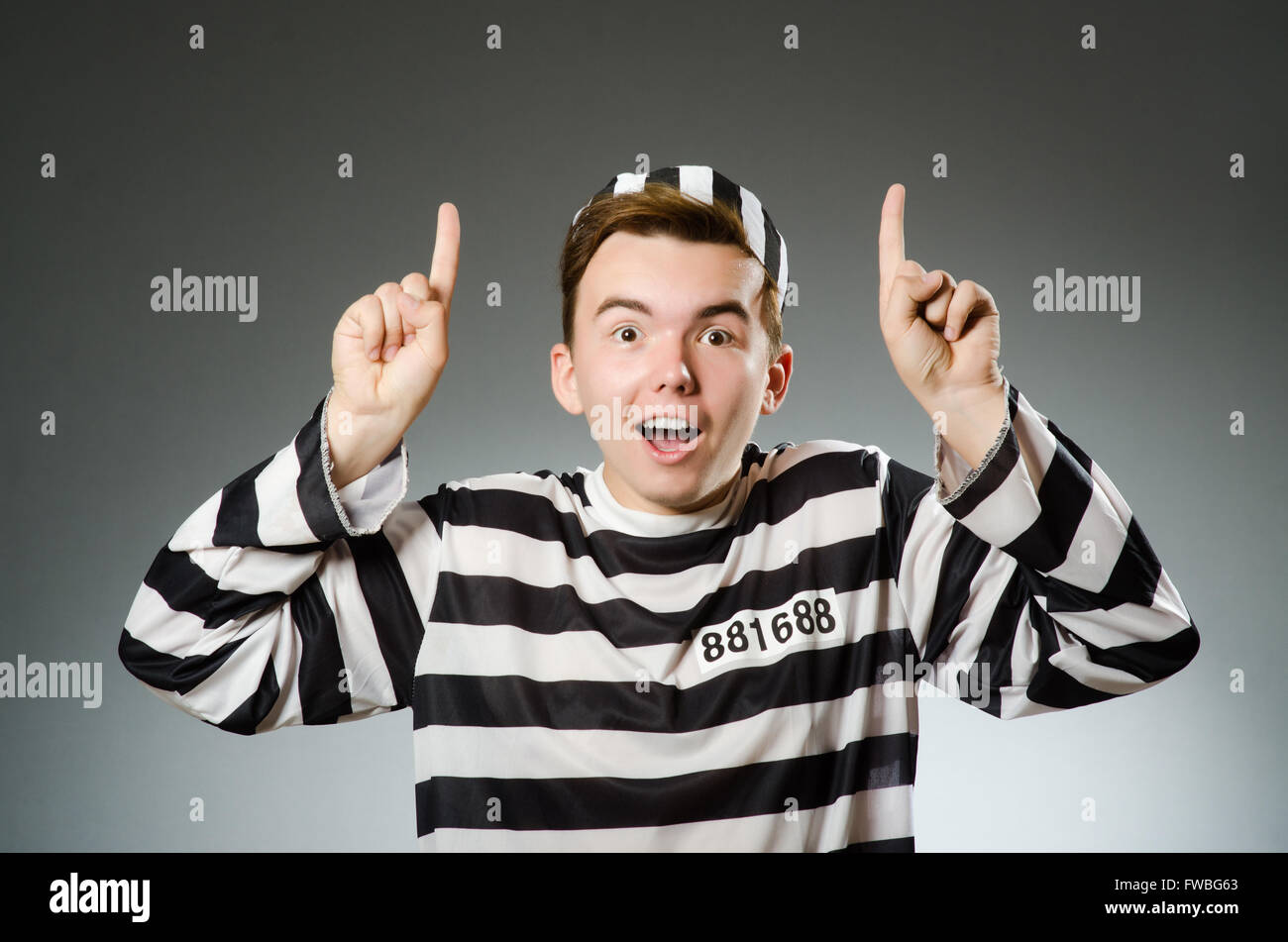 Funny prisoner in prison concept Stock Photo - Alamy