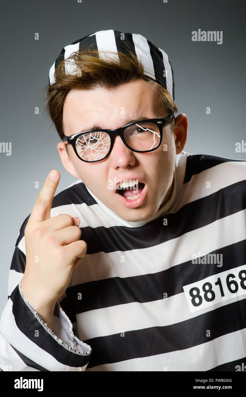 Funny prisoner in prison concept Stock Photo - Alamy