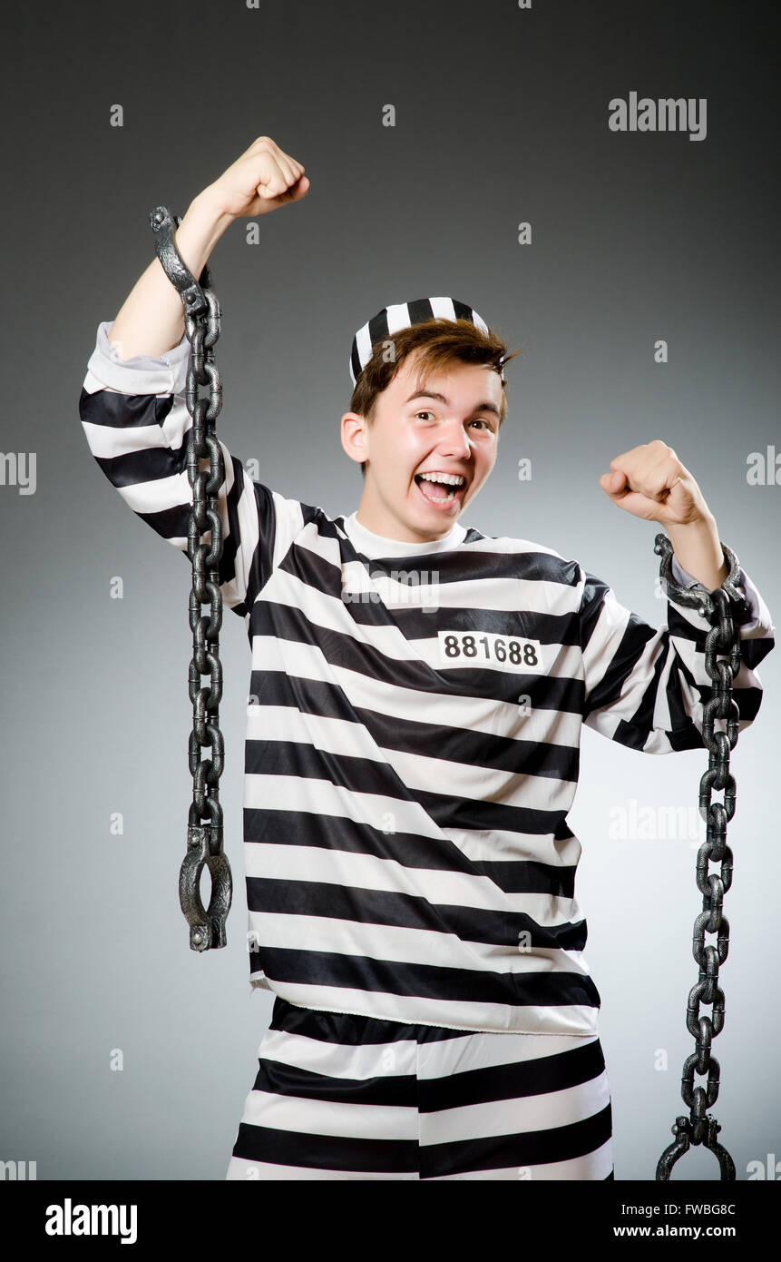 Funny prisoner in prison concept Stock Photo - Alamy