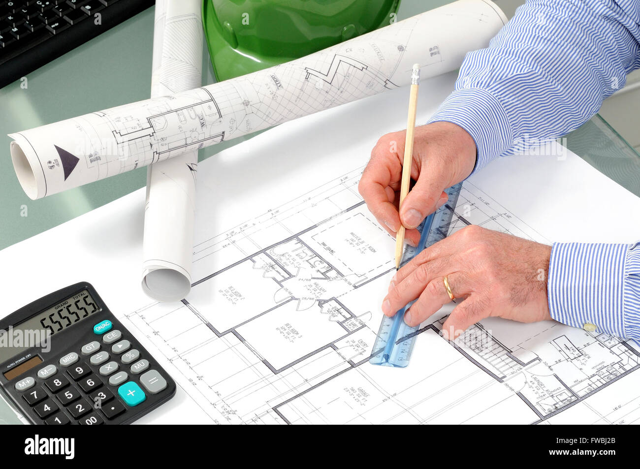 Engineer at work in the office on a residential construction project ...