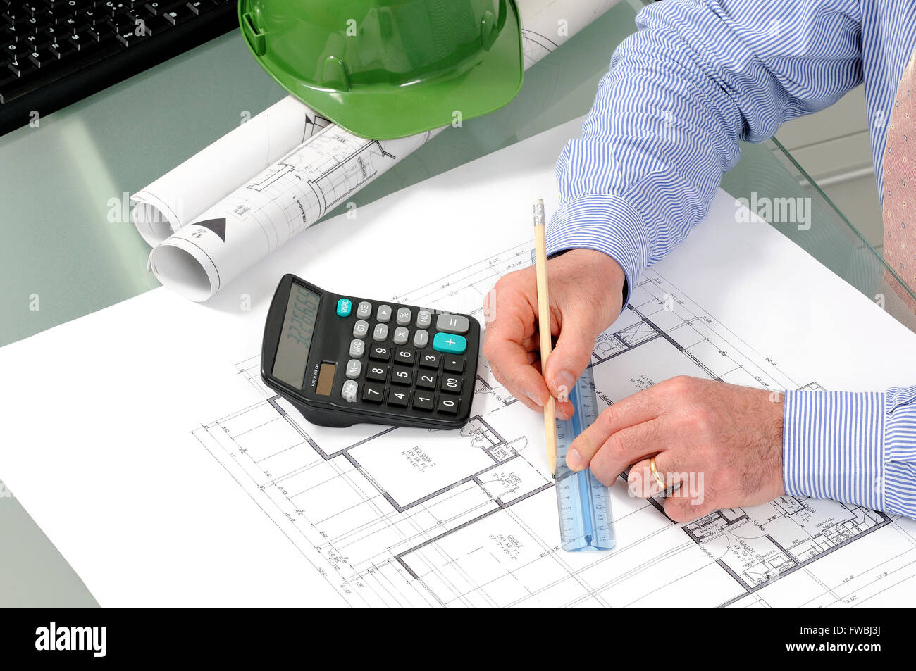 Engineer at work in the office on a residential construction project ...