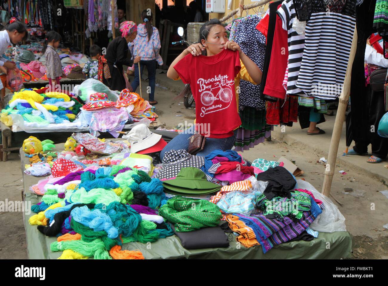Asian woman selling clothes hi-res stock photography and images - Alamy