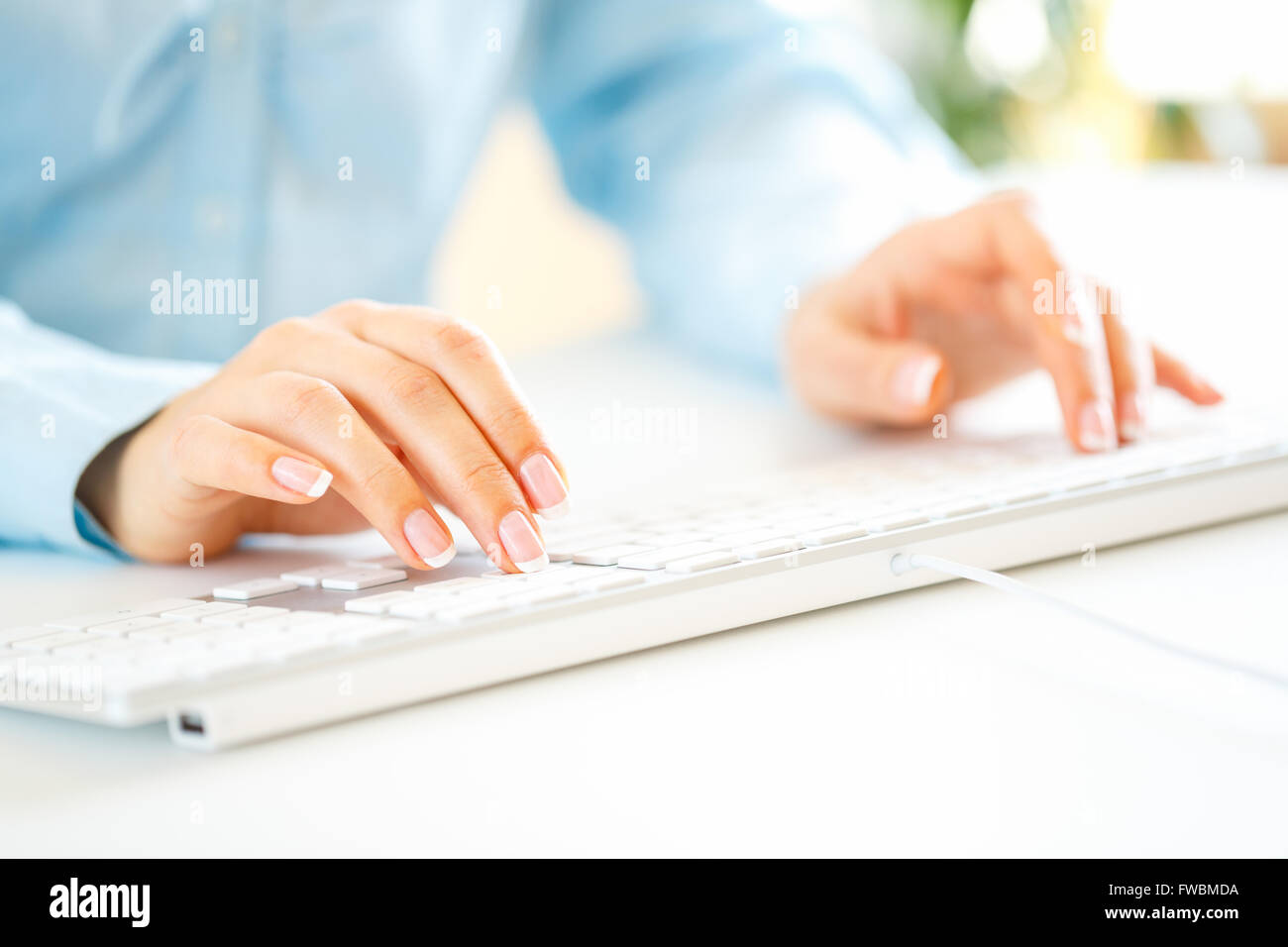 Female hands or woman office worker typing on the keyboard Stock Photo ...