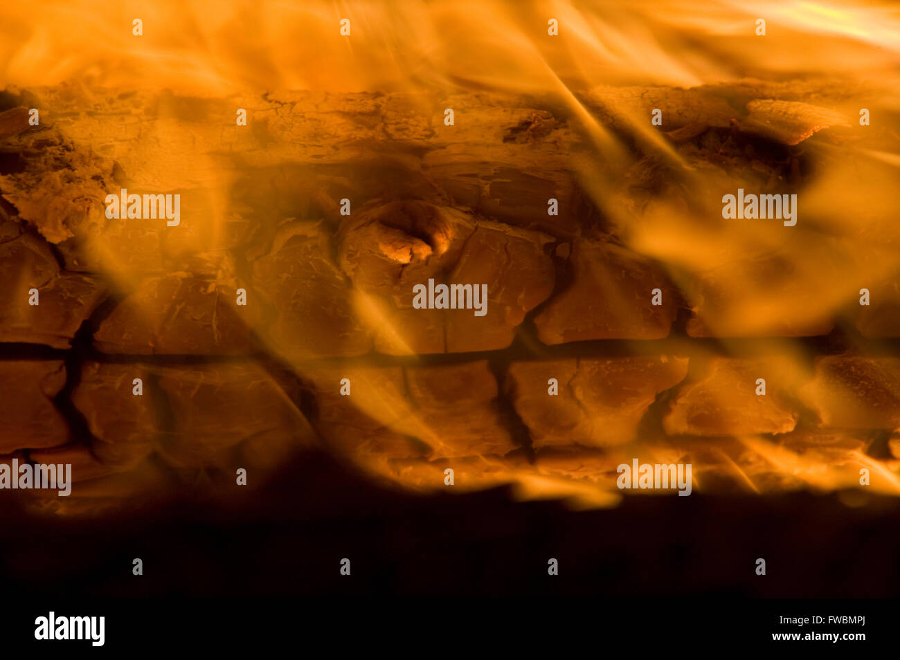 Logs, wood burning on what could be described as a funeral pyre in some ...