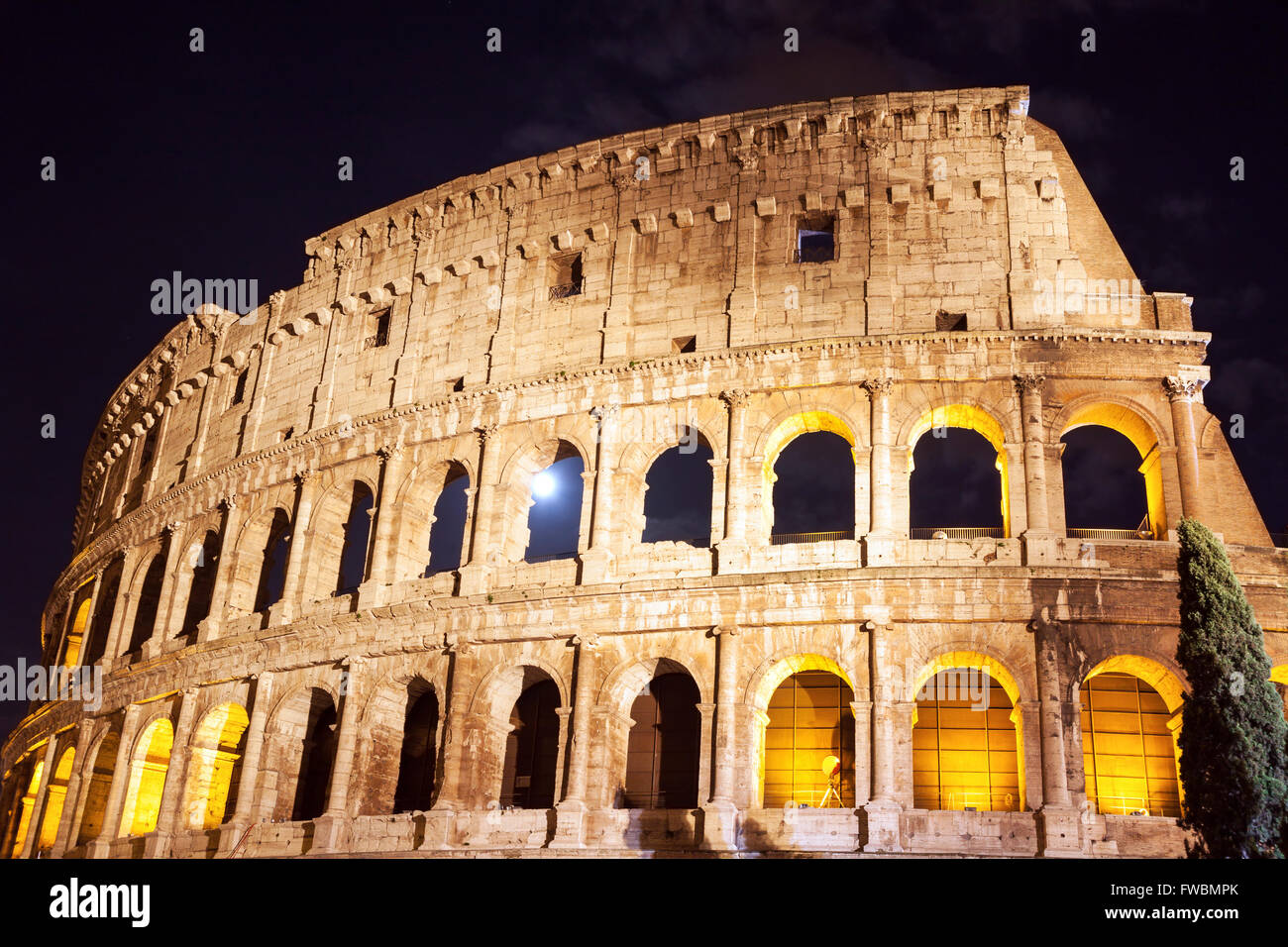 Colosseum at night with the full moon Stock Photo - Alamy