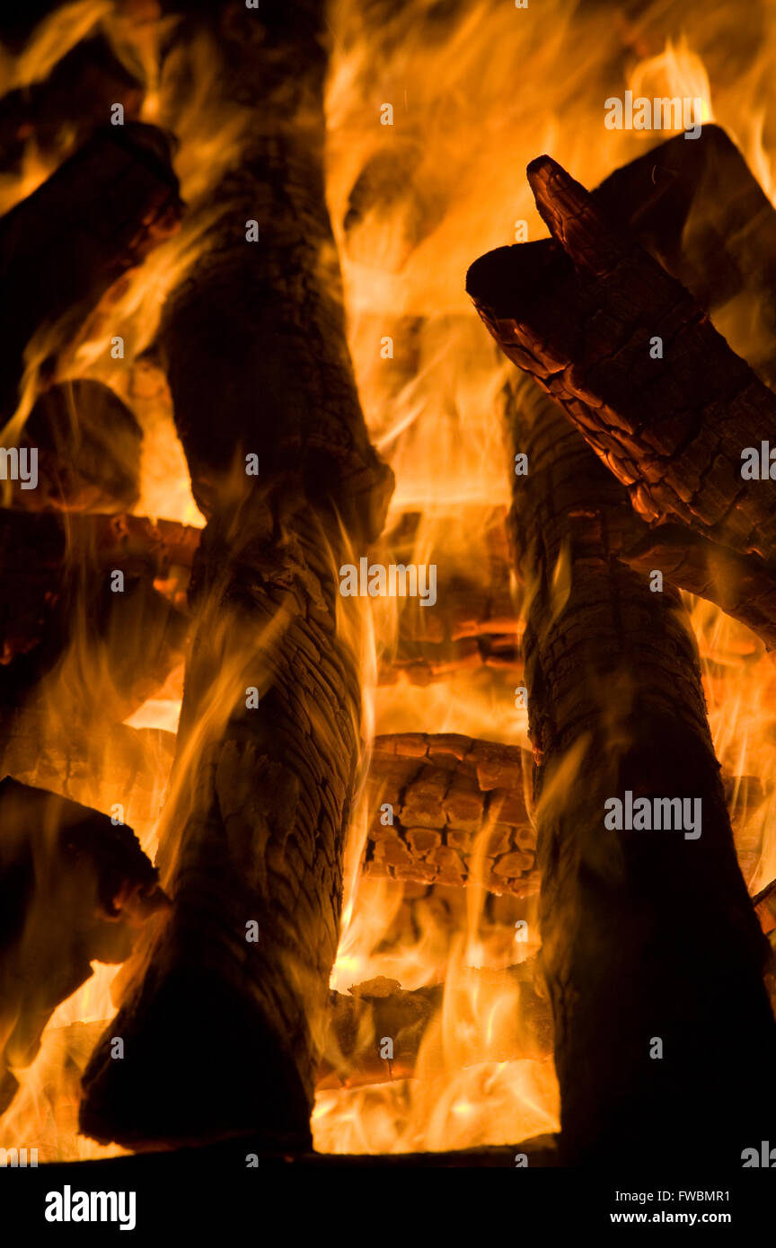 Logs, wood burning on what could be described as a funeral pyre in some ...