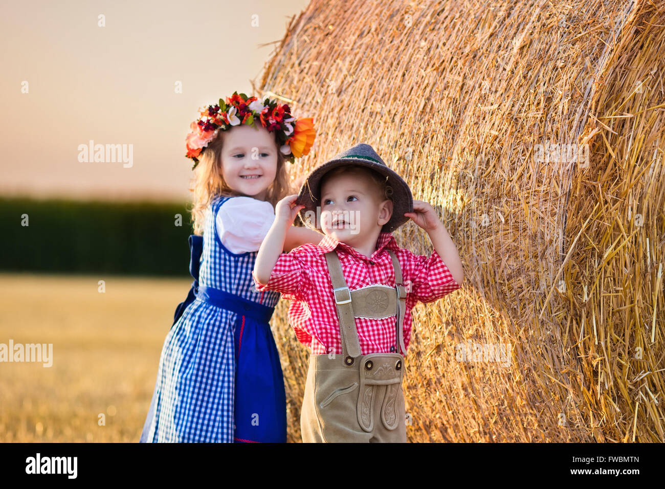 Kids in traditional Bavarian costumes in wheat field. German children ...