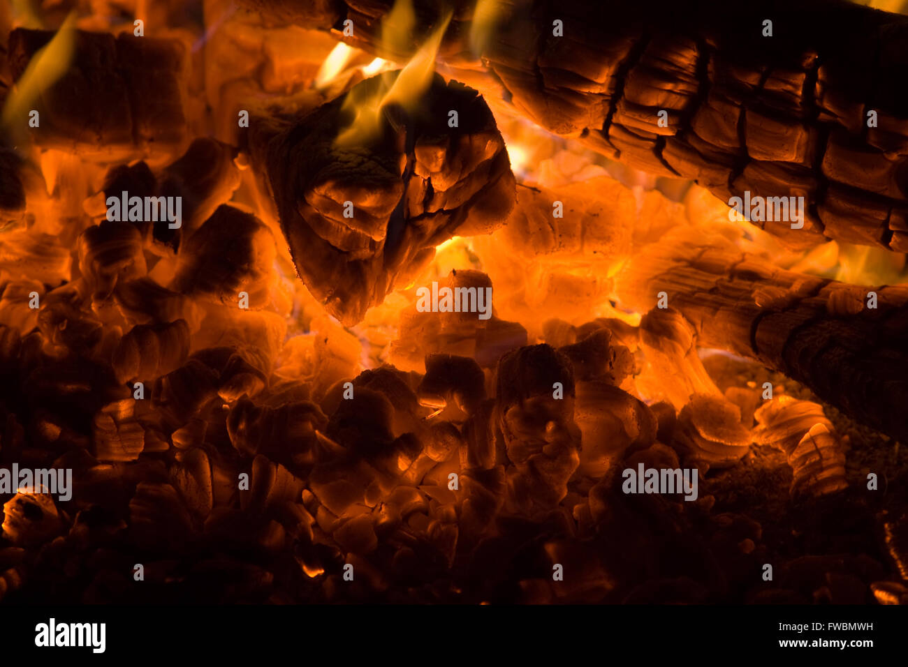 Logs, wood burning on what could be described as a funeral pyre in some ...