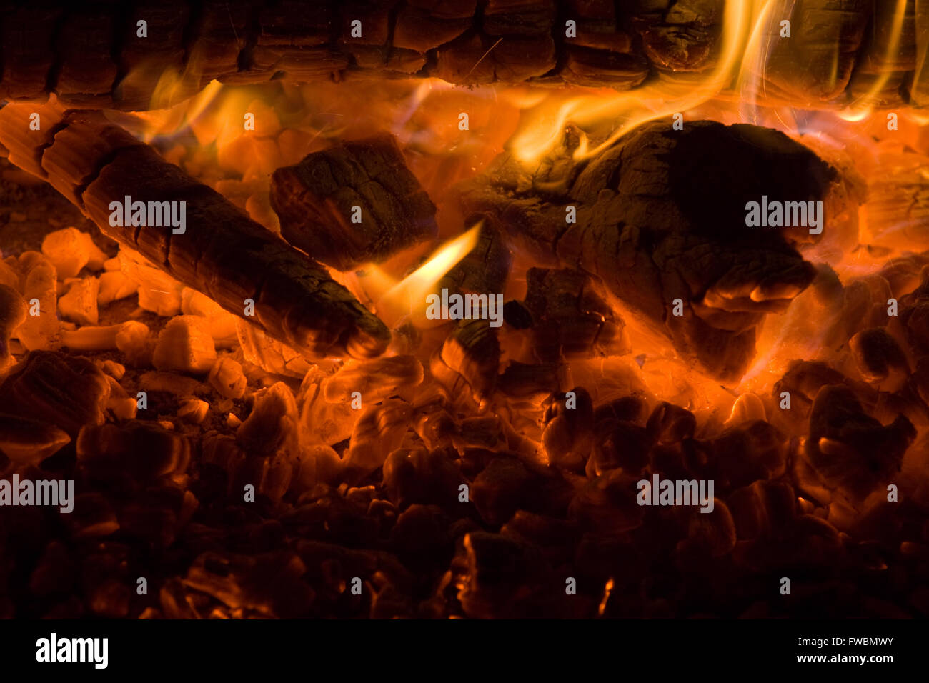 Logs, wood burning on what could be described as a funeral pyre in some ...