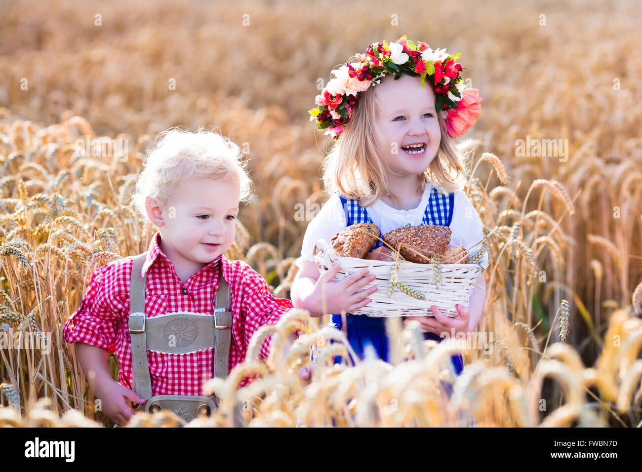 Kids in traditional Bavarian costumes in wheat field. German children ...