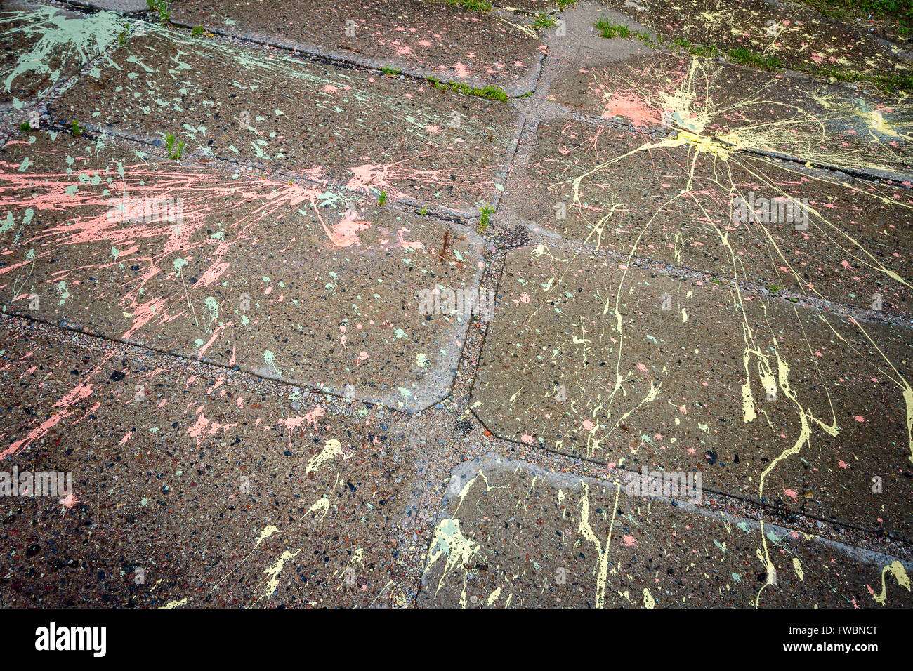 Splashes of paint on old concrete paving texture Stock Photo - Alamy