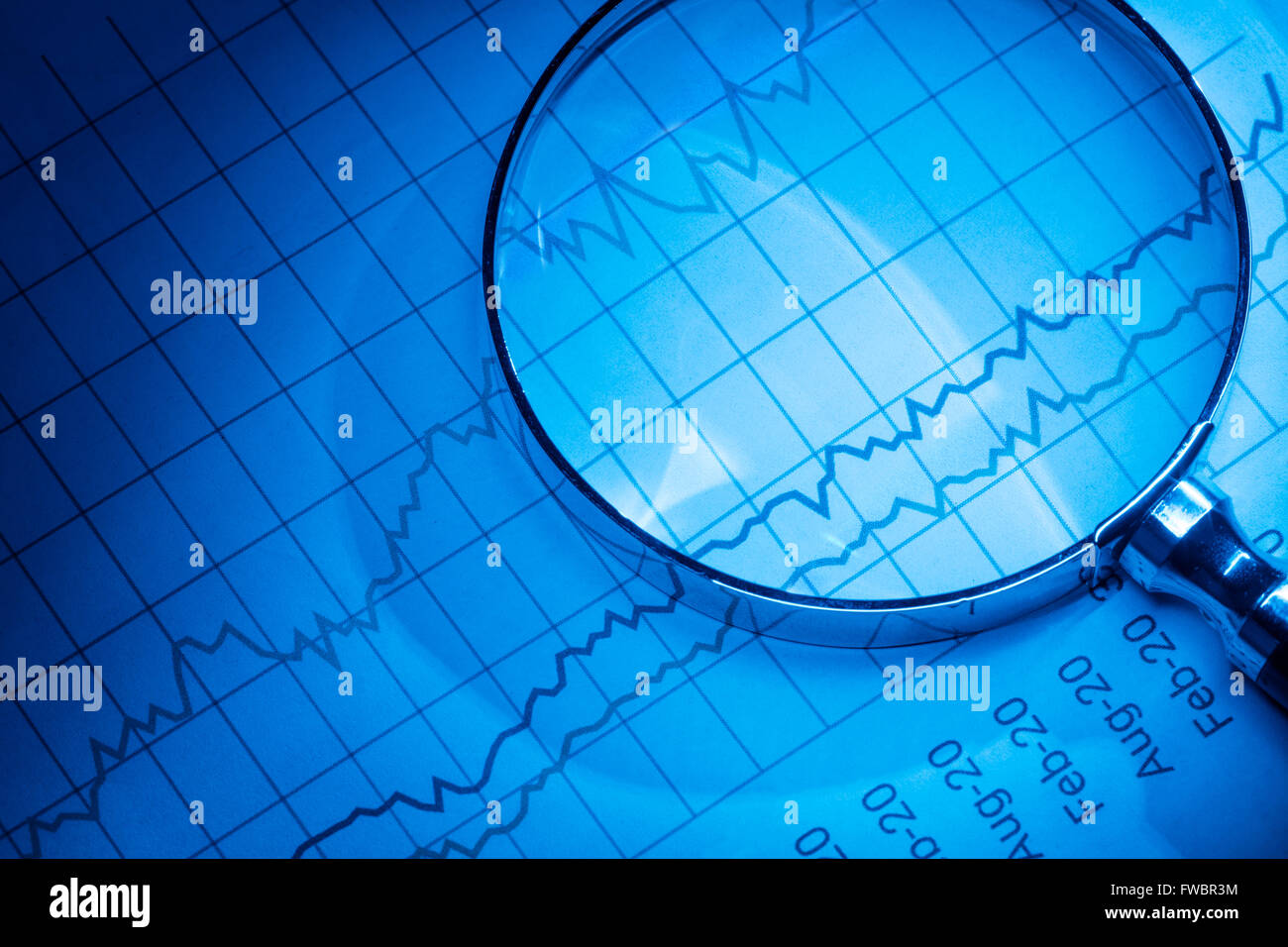 Business chart and magnifying glass, concept of analyzing Stock Photo ...